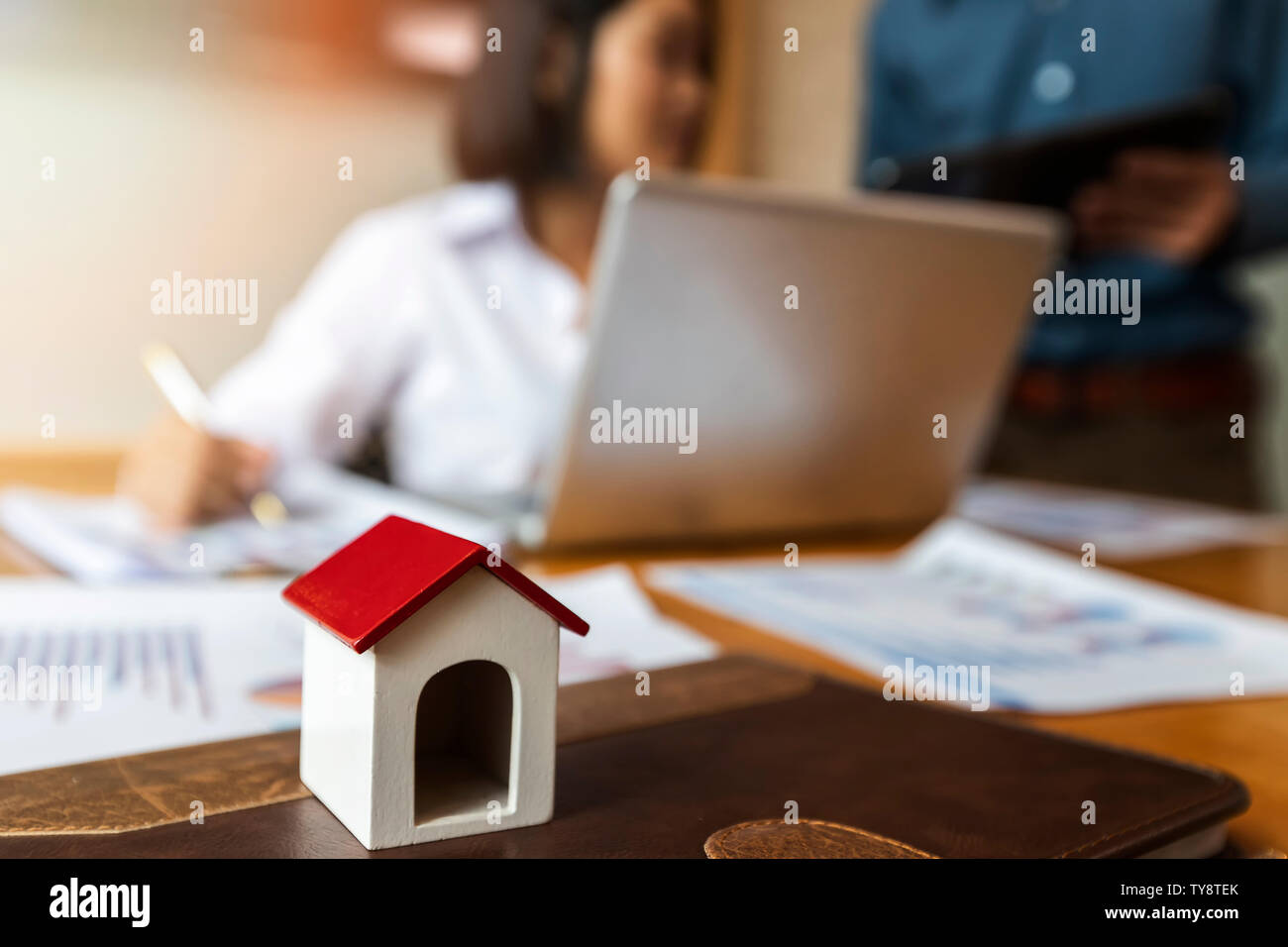 Business people are discussing about the real estate project behind ...