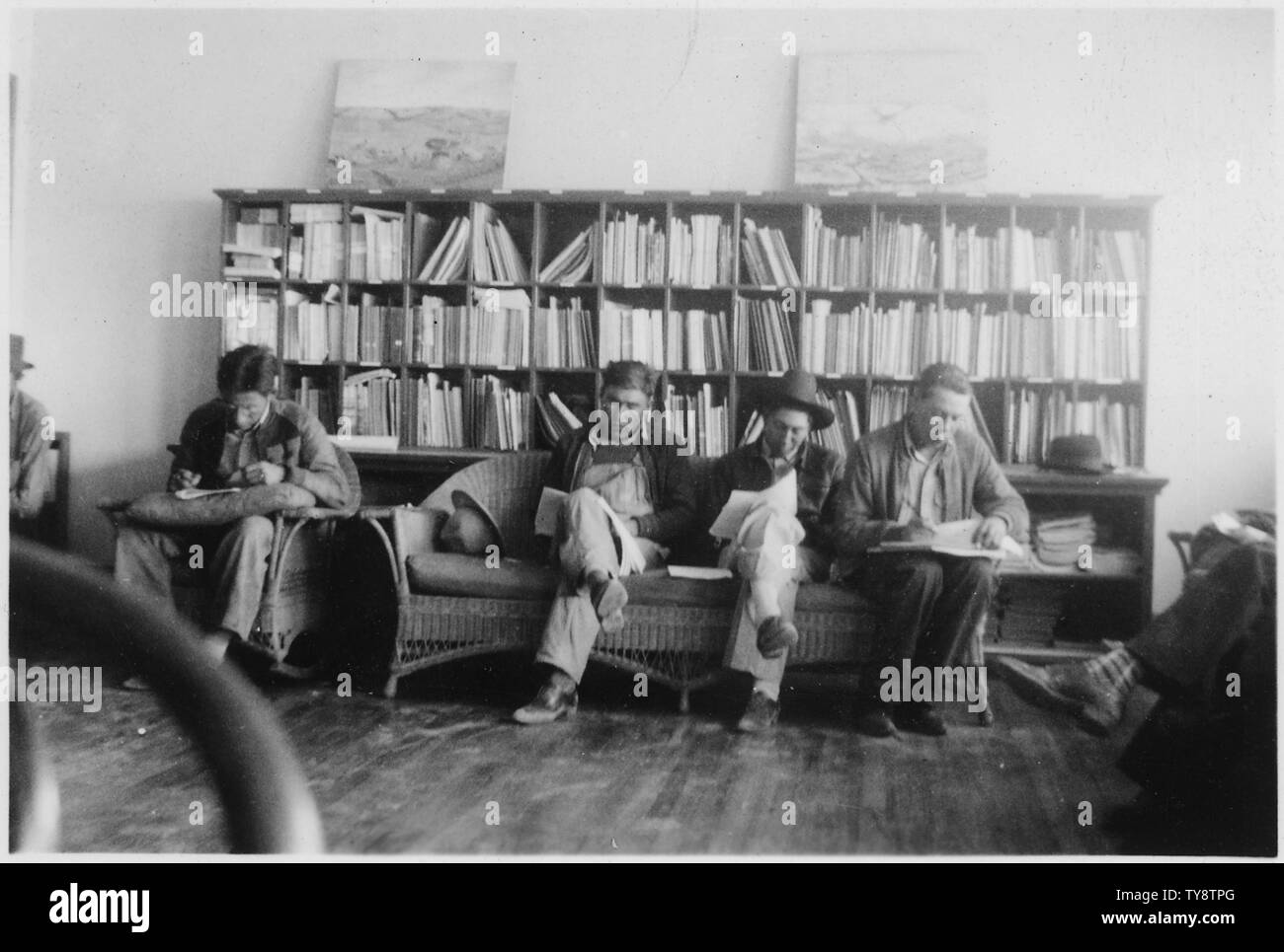 Men filing out forms in an office Stock Photo - Alamy