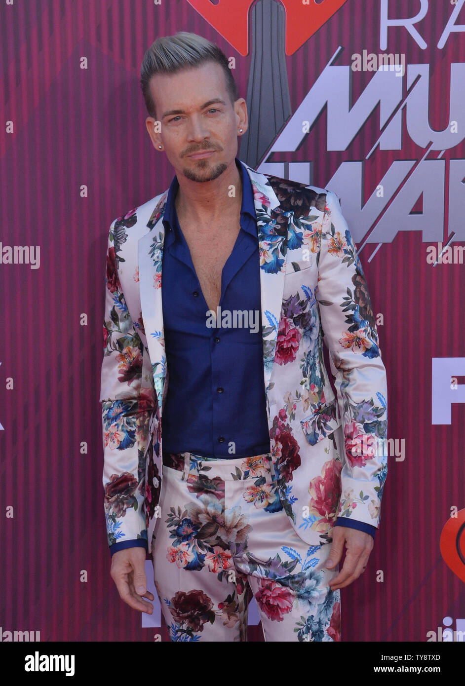 Damon Sharpe arrives for the sixth annual iHeartRadio Music Awards at ...