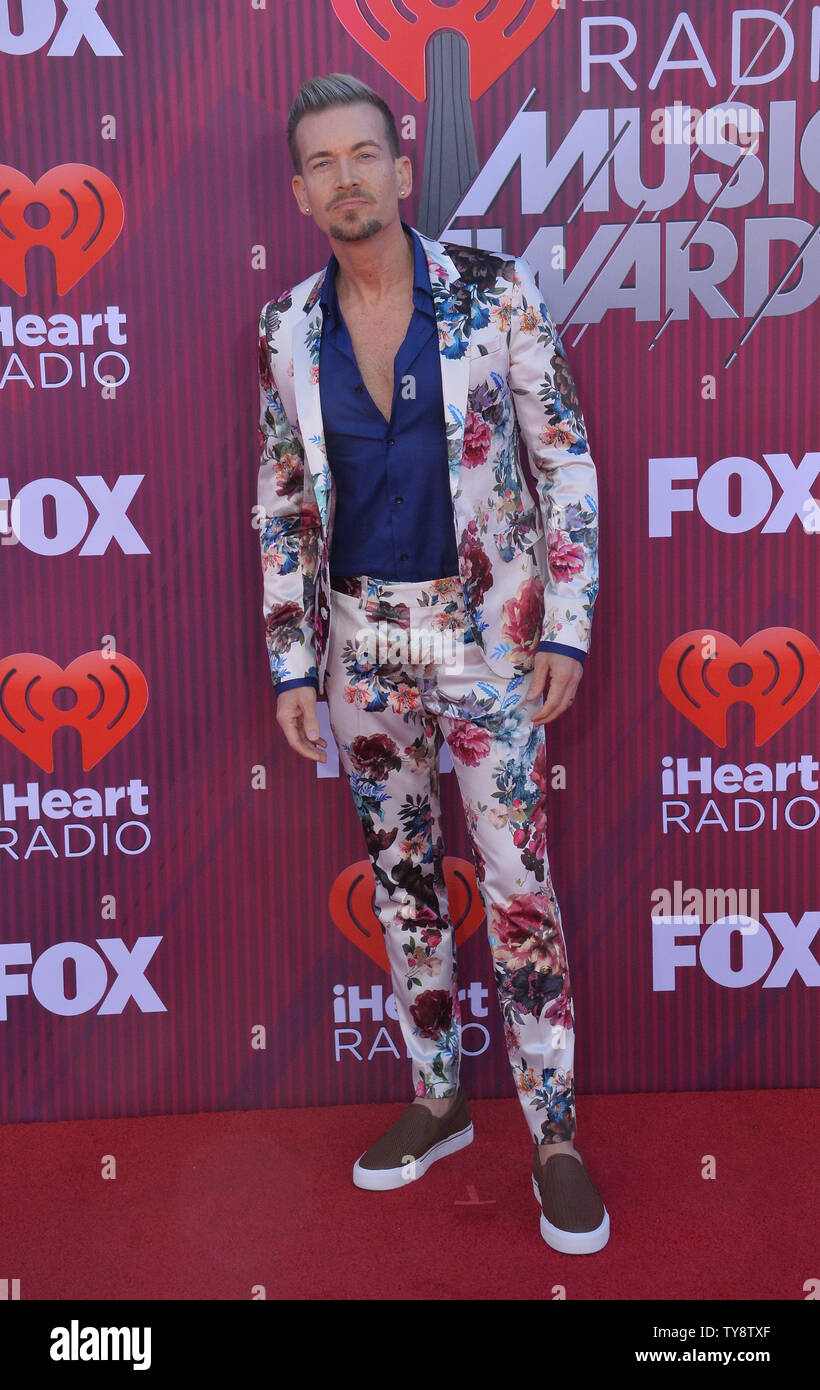 Damon Sharpe arrives for the sixth annual iHeartRadio Music Awards at ...