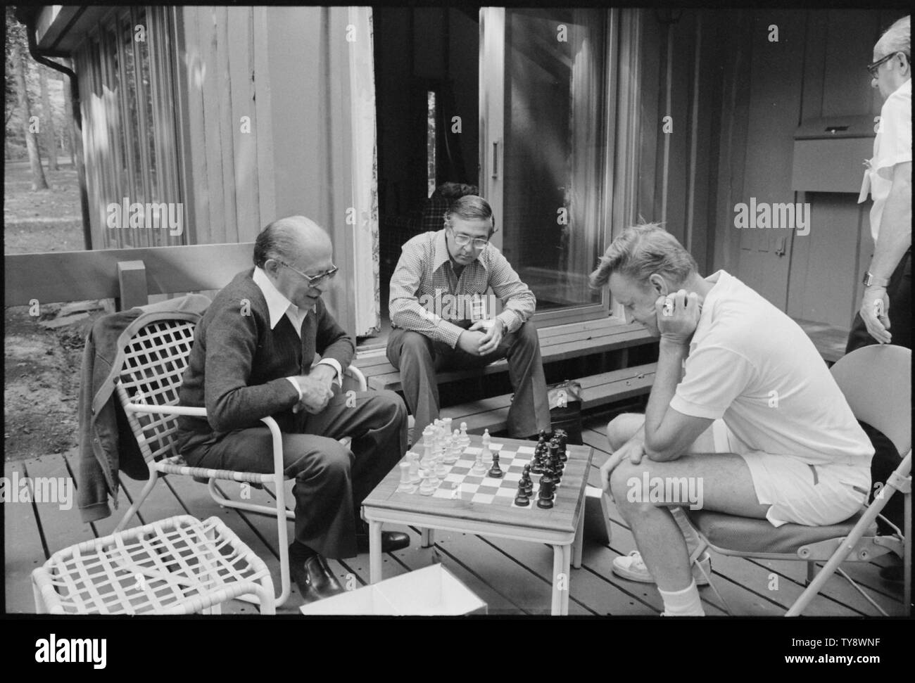 Menahem Begin and Zbigniew Brzezinski play chess at Camp David Stock ...