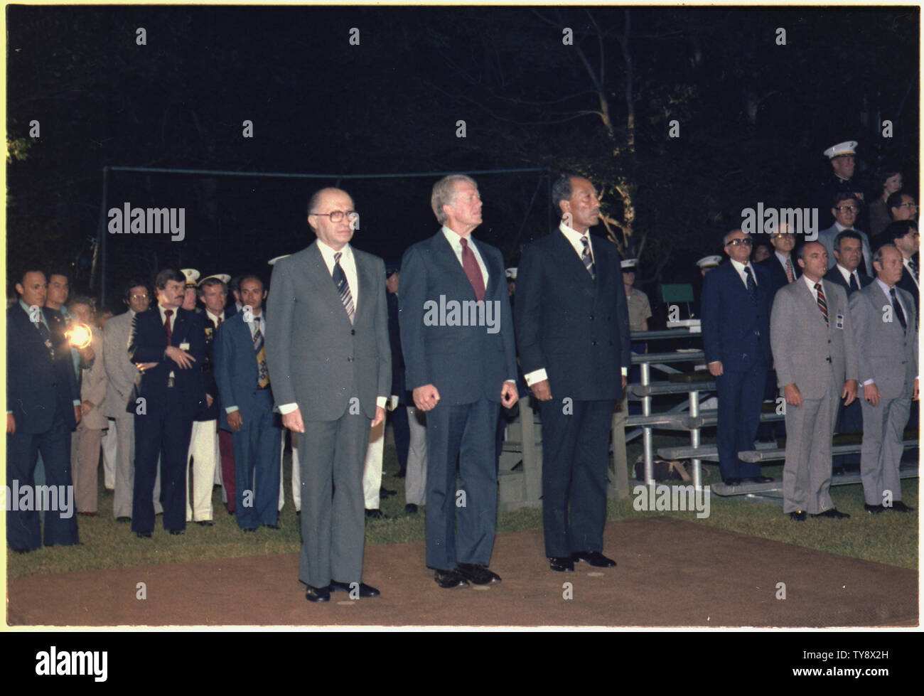 Menachem Begin, Jimmy Carter and Anwar Sadat attend a military ...