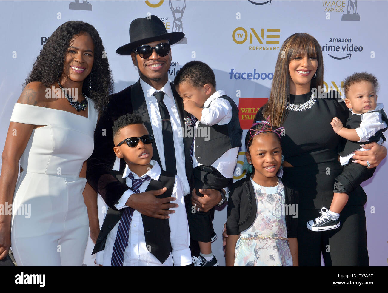 Ne-Yo (3rd from left) and his family arrive for the 50th annual NAACP ...