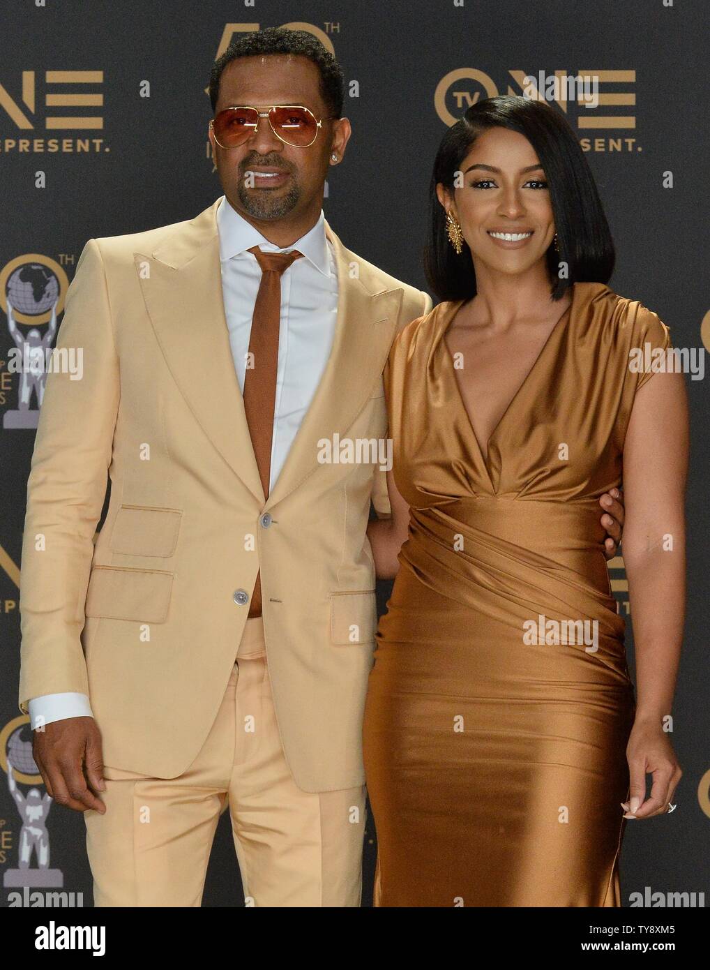 (L-R) Mike Epps and Kyra Robinson appear backstage during the 50th ...