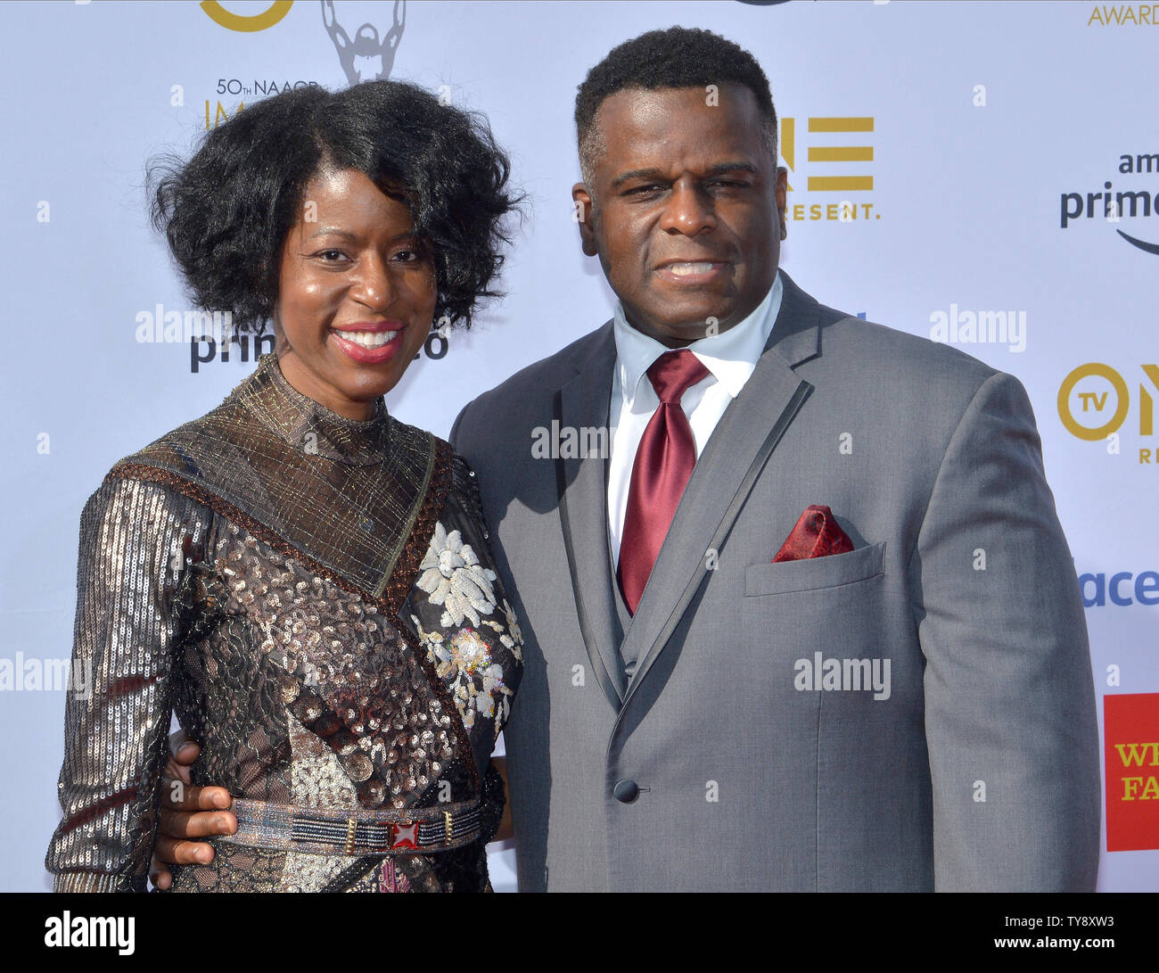 Karen Peterkin (L) and Antoine Lewis arrive for the 50th annual NAACP ...