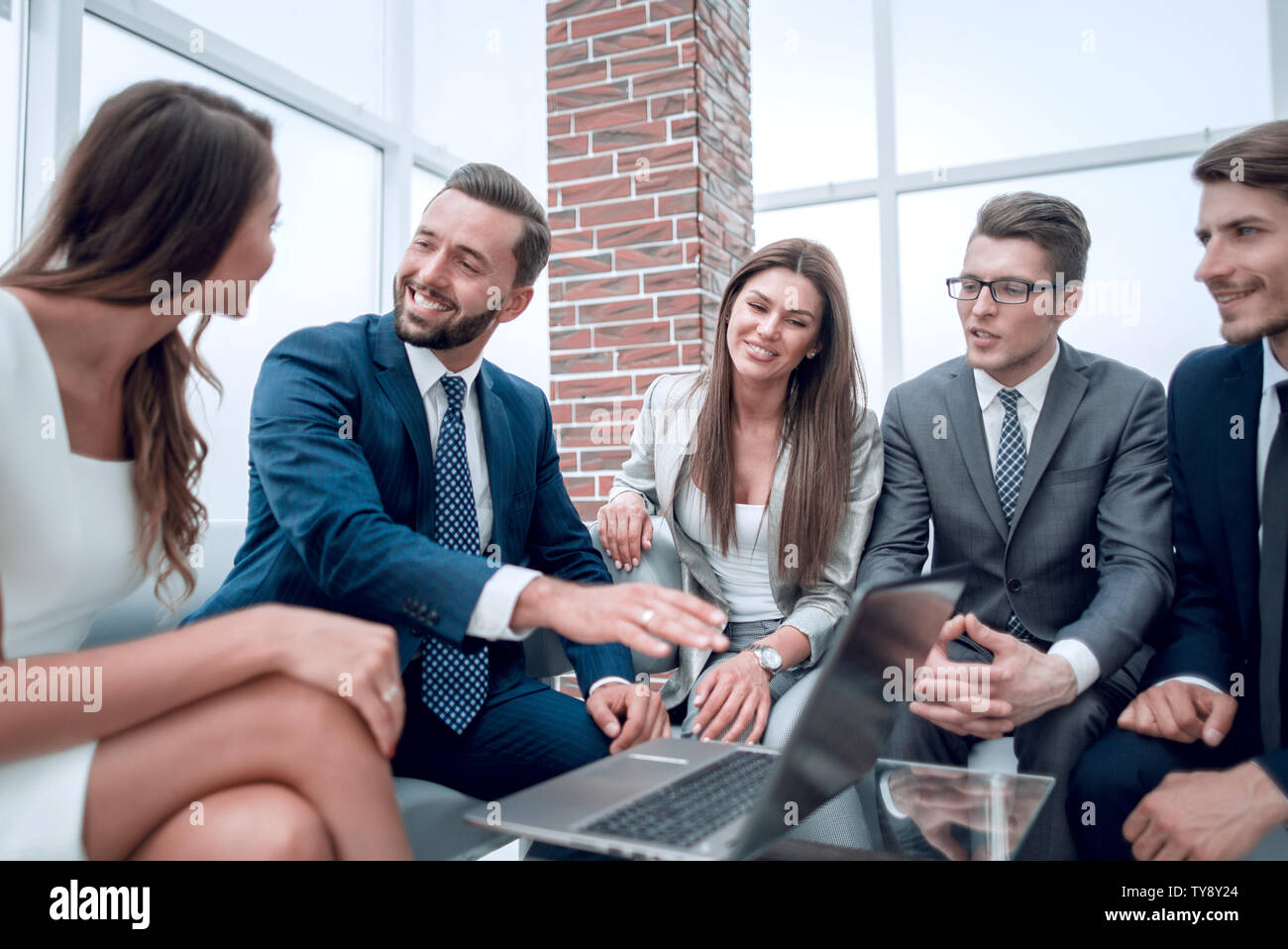business team looking at the laptop screen Stock Photo - Alamy