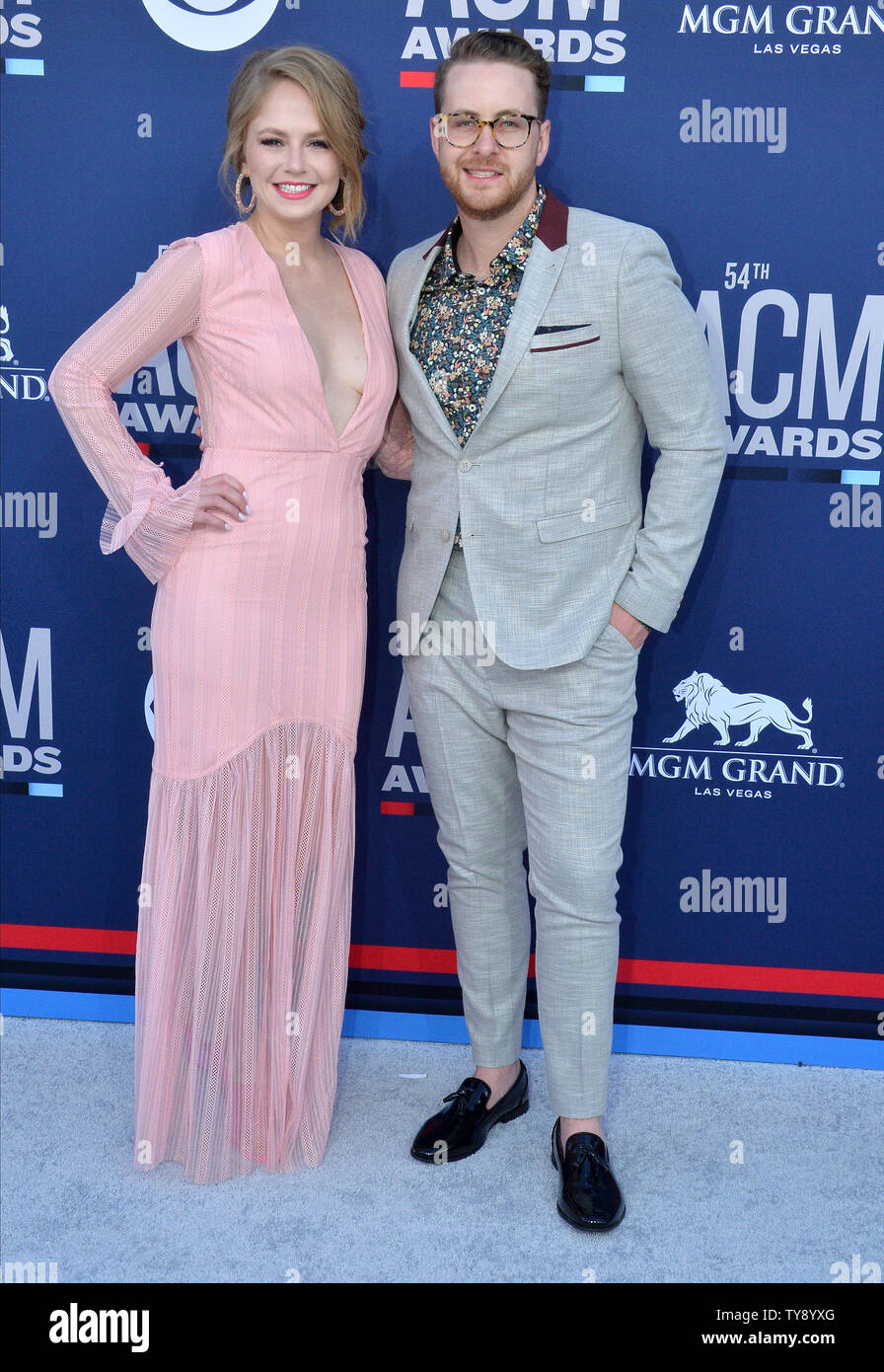 Jordan Reynolds (R) and guest attend the 54th annual Academy of Country ...