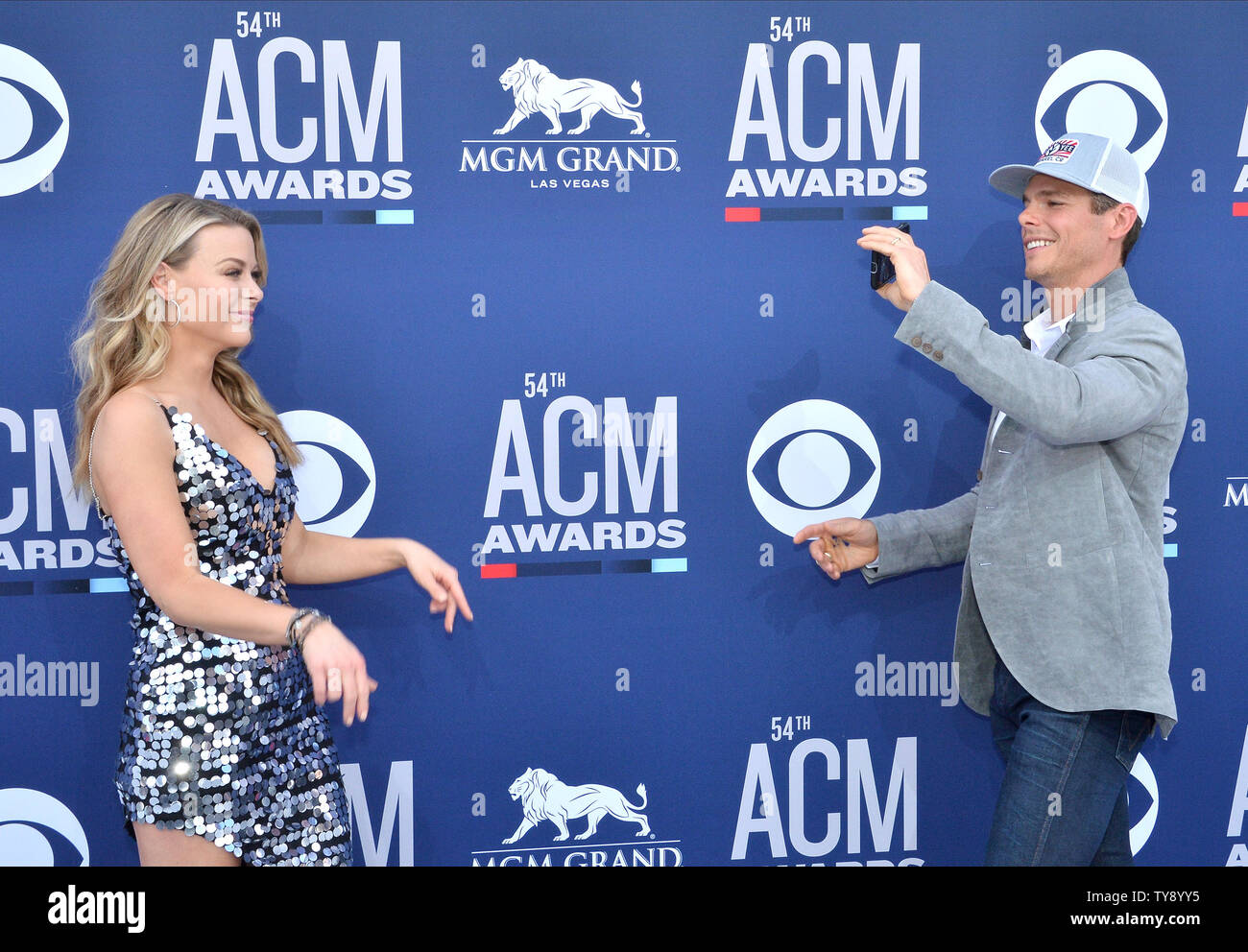 Amber Bartlett and Granger Smith (R) attend the 54th annual Academy of ...