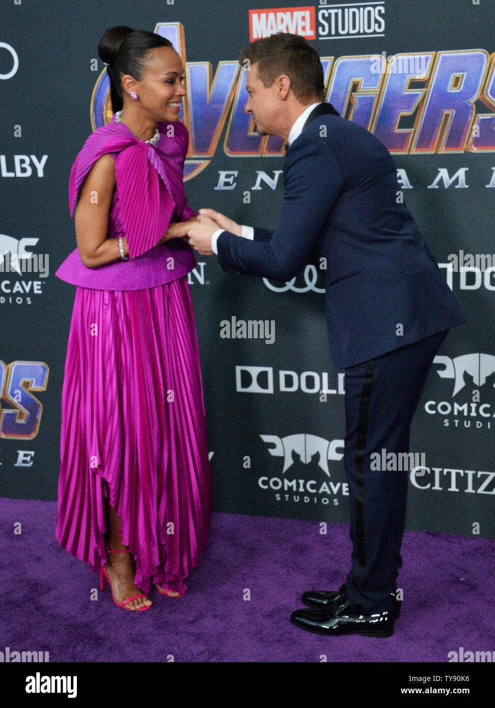 Cast member Jeremy Renner and actress Zoe Saldana attend the premiere ...