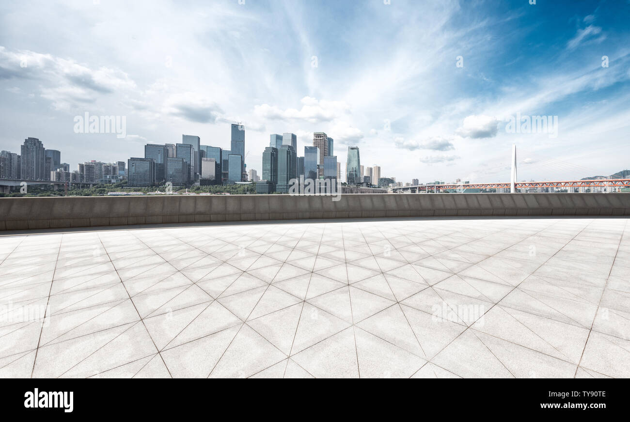 empty brick floor with cityscape of modern city Stock Photo - Alamy