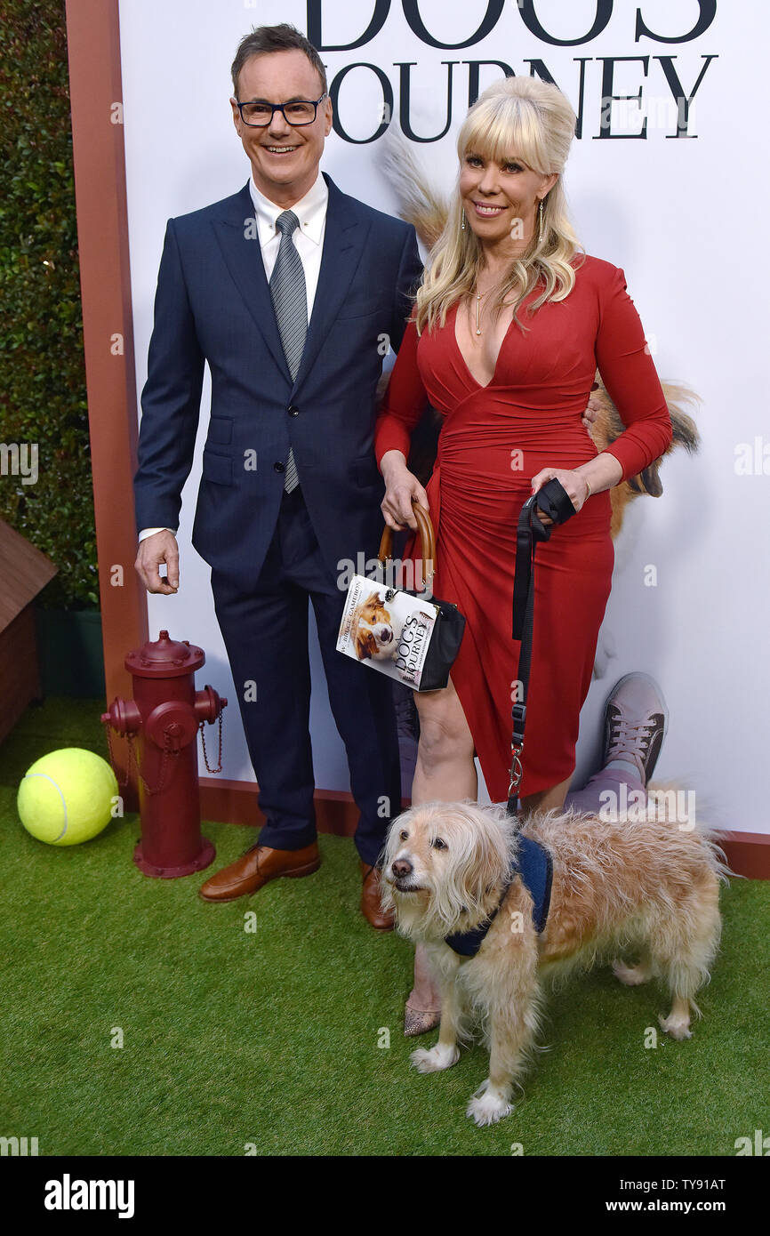 Writers W. Bruce Cameron (L) and Cathryn Michon attend the premiere of ...