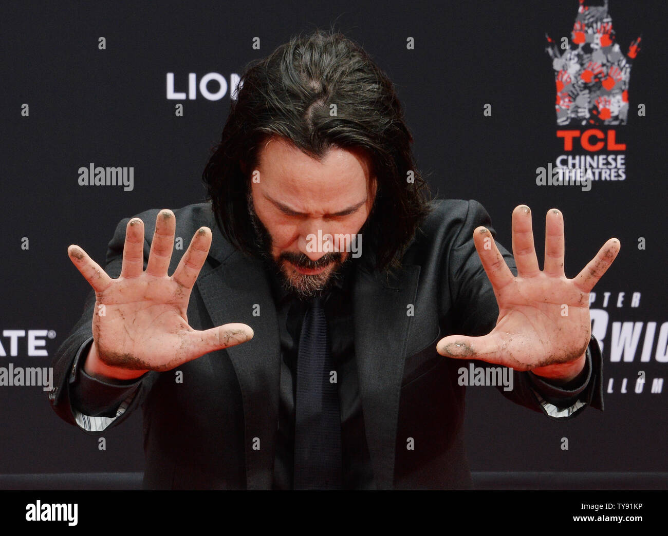 Actor Keanu Reeves participates in a hand and footprint ceremony ...