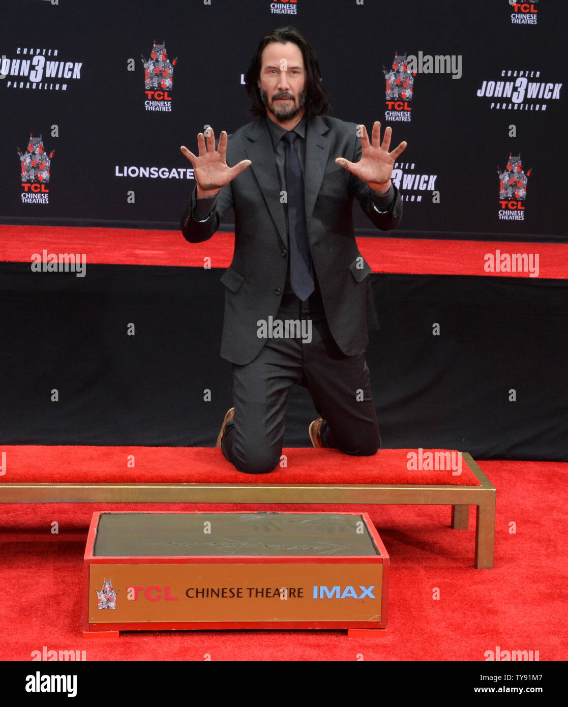 Actor Keanu Reeves participates in a hand and footprint ceremony ...