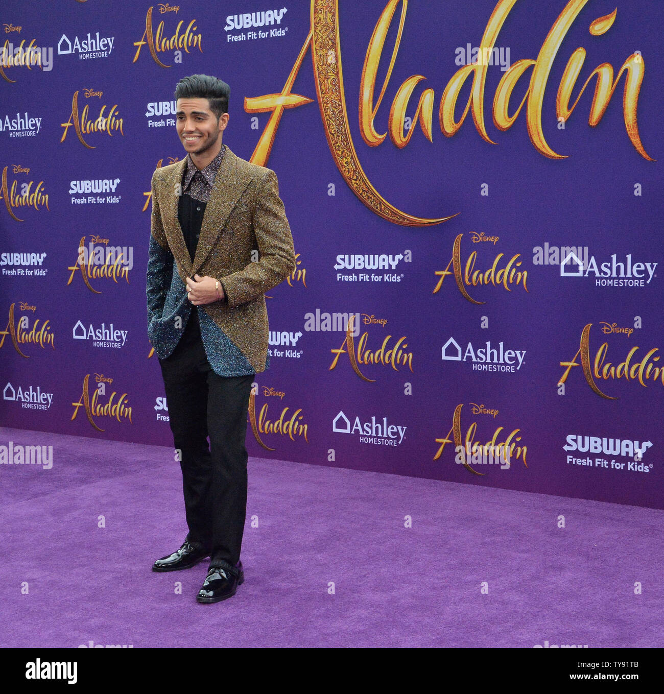 Cast member Mena Massoud attends the premiere of the motion picture ...