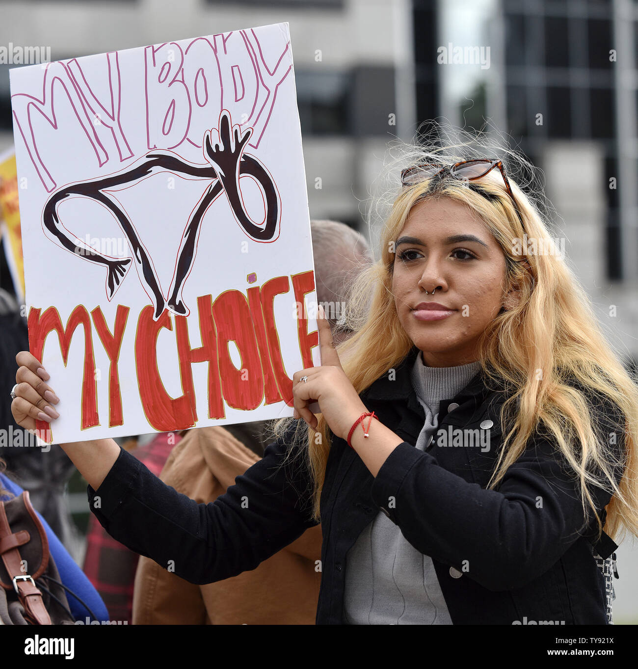 An abortion rights advocate holds her sign at a Stop Abortion Bans ...