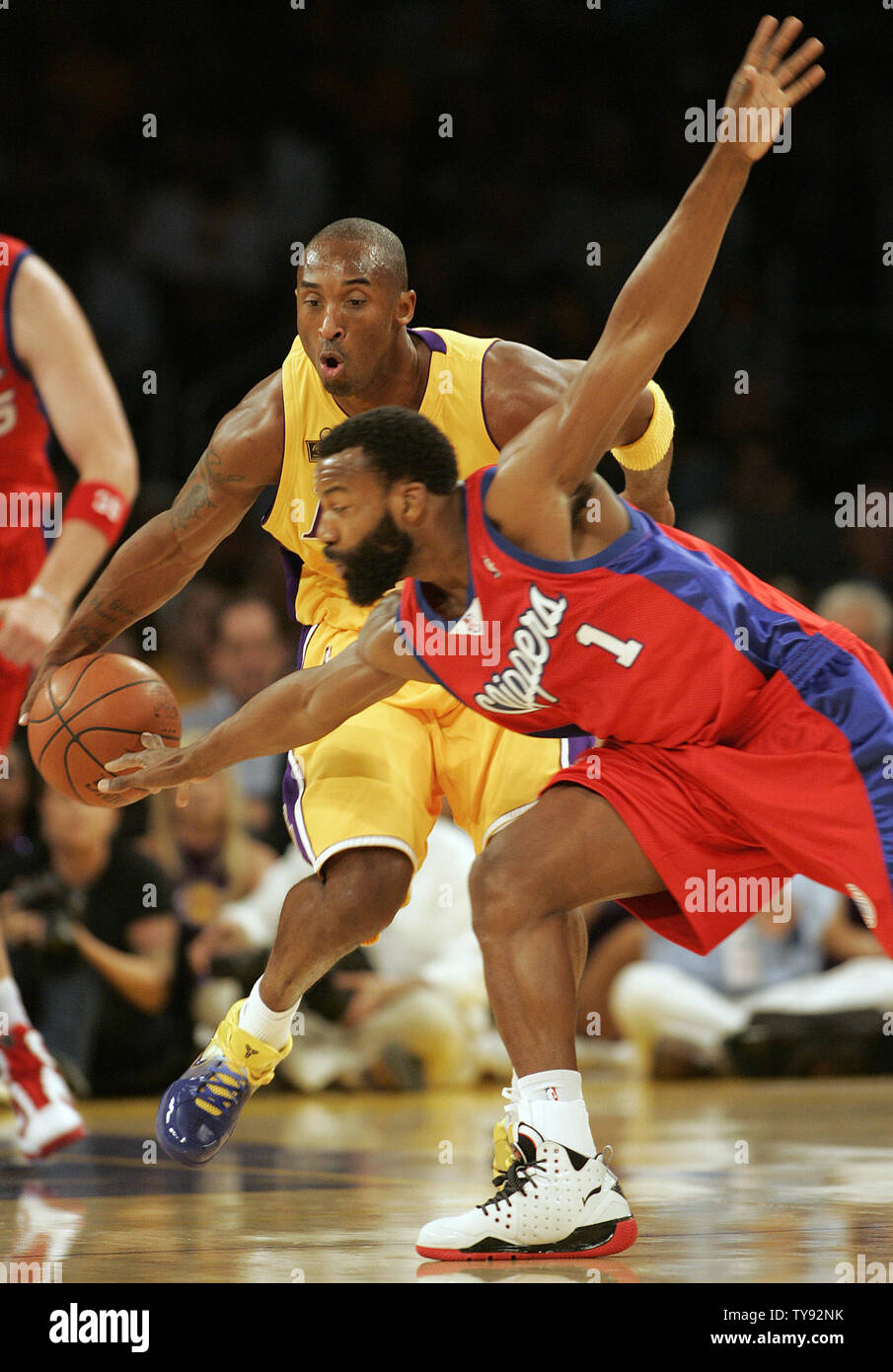 Los Angeles Lakers guard Kobe Bryant keeps the ball away from Los ...