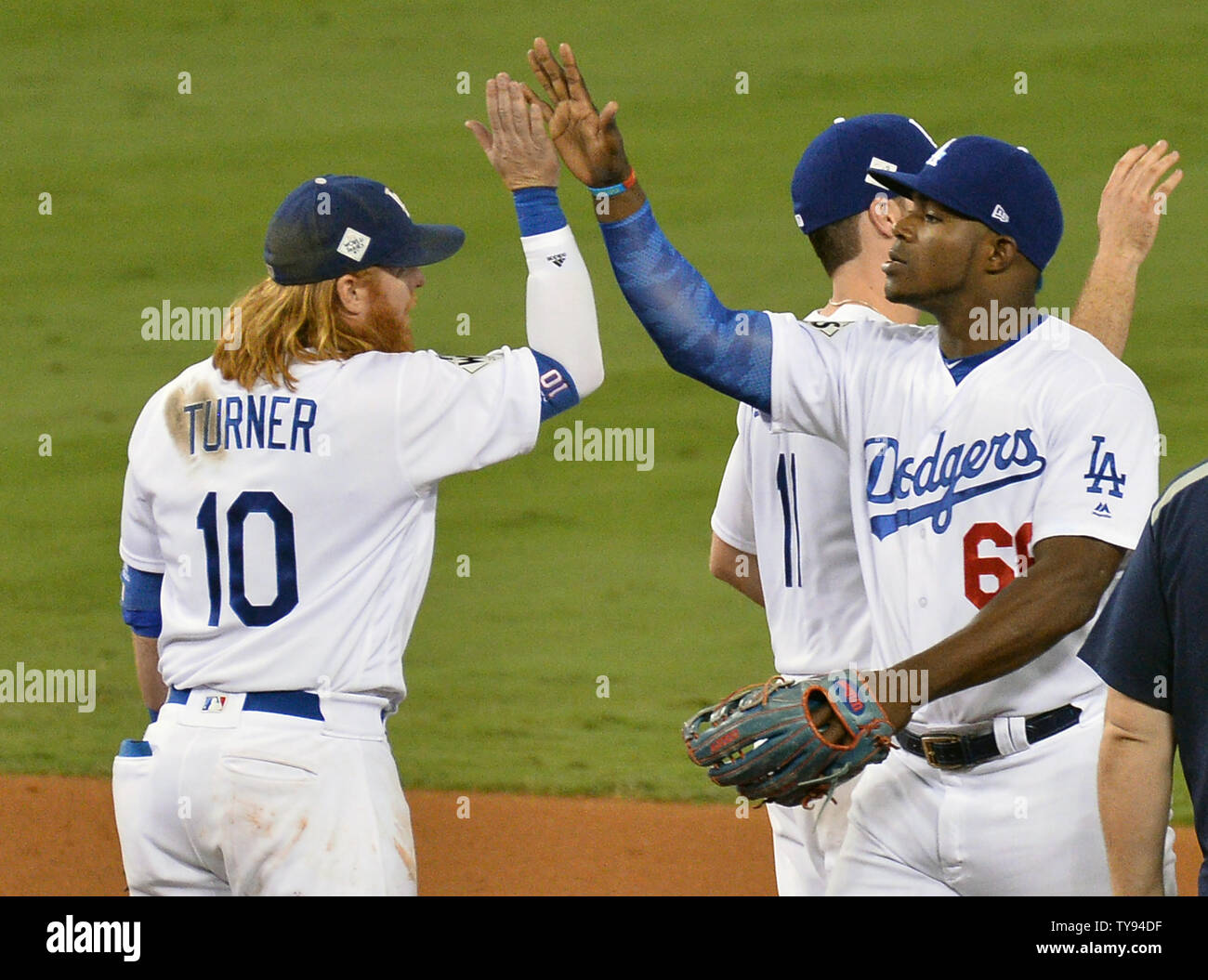 Los Angeles Dodgers third baseman Justin Turner (10) high fives ...