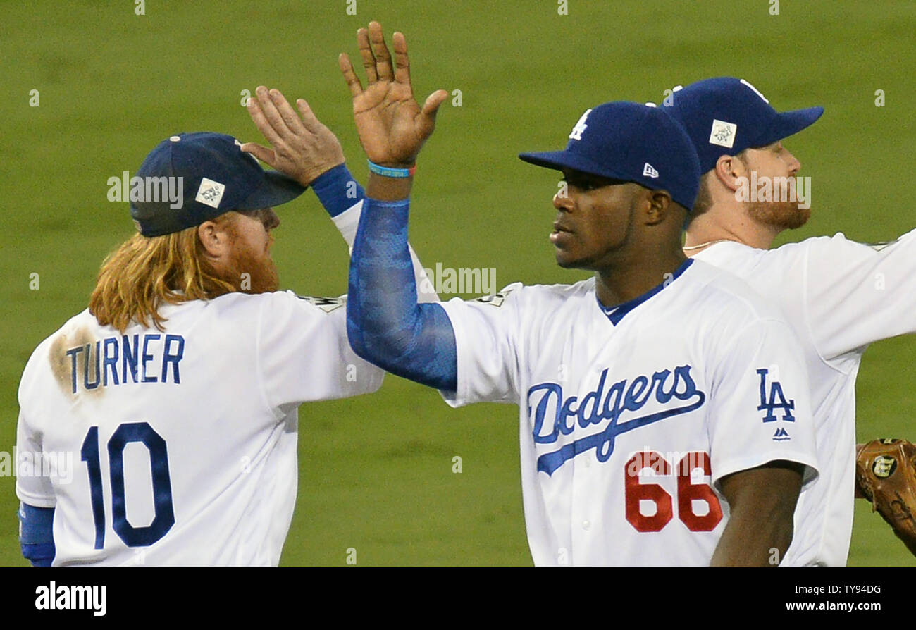 Los Angeles Dodgers third baseman Justin Turner (10) high fives ...