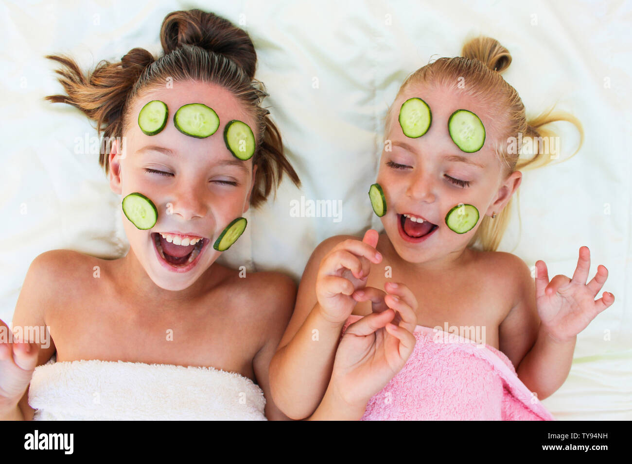 Beautiful girl with facial mask of cucumber Stock Photo - Alamy