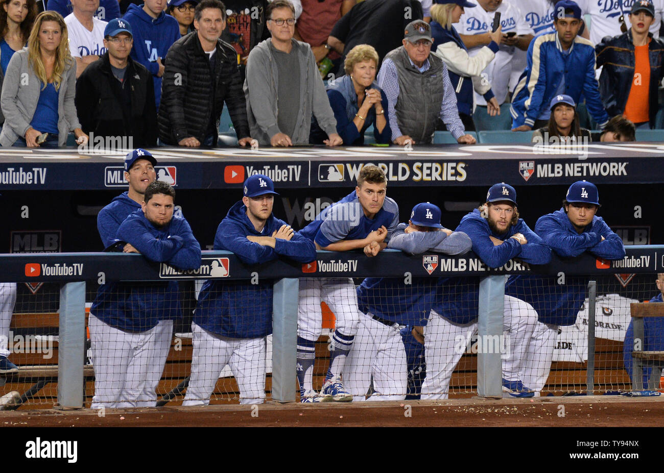 Los Angeles Dodgers line the dugout in the ninth inning against the ...