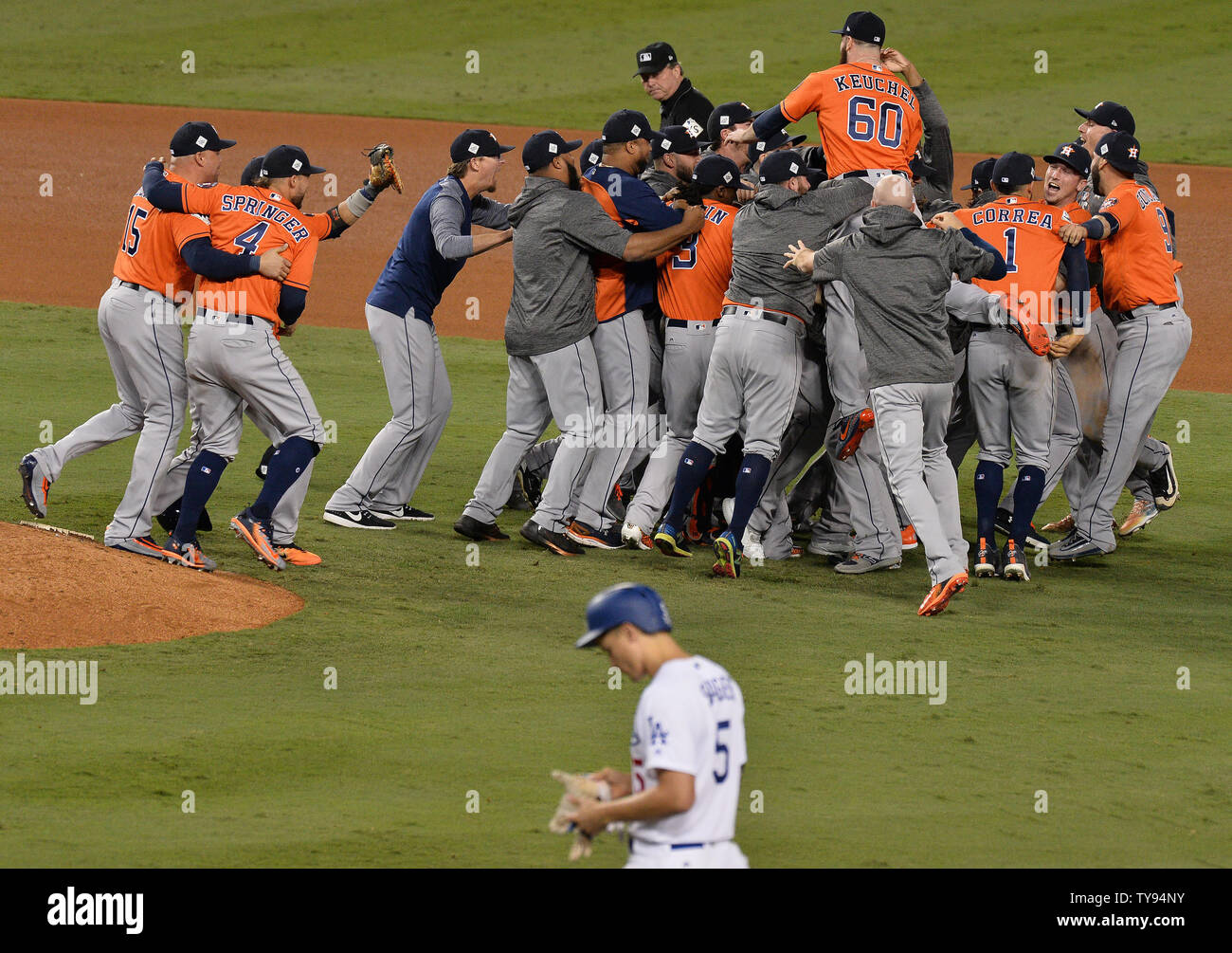 Los Angles Dodgers Corey Seager (5) walks past the celebrating Houston ...