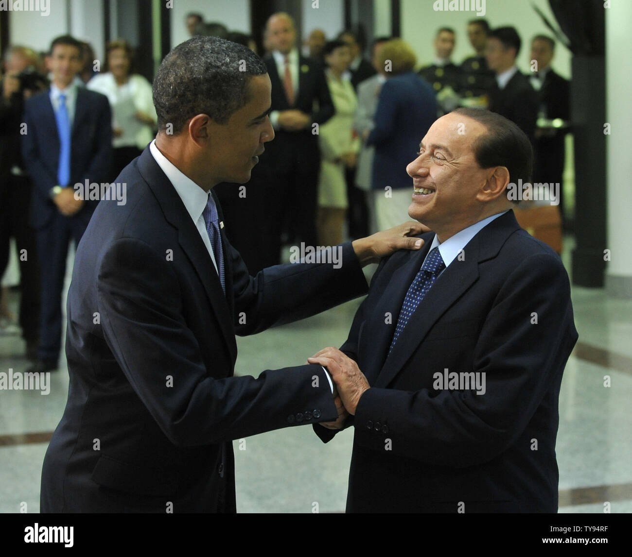 Italian Prime Minister Silvio Berlusconi (R) greets U.S. President ...