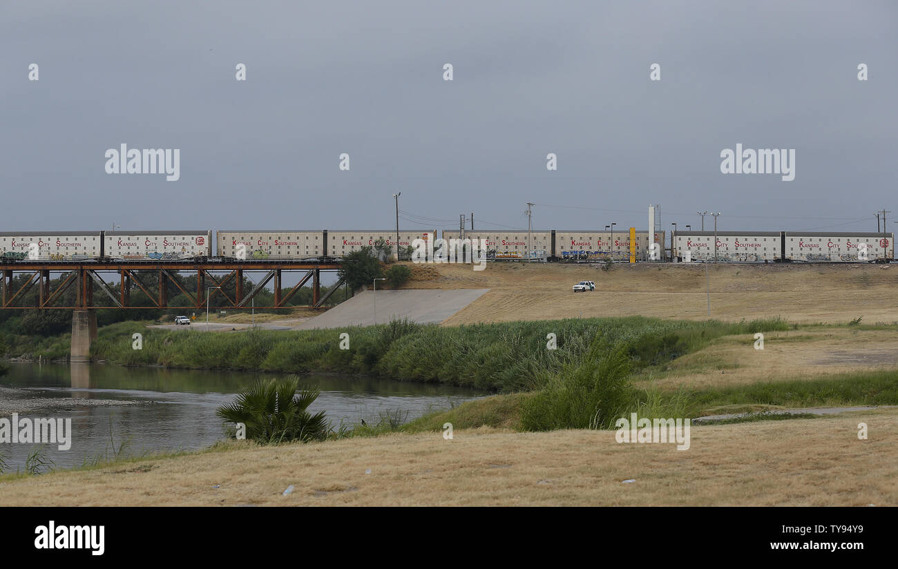 U.S. Border Patrol agents watch the Rio Grande River at the U.S.-Mexico ...