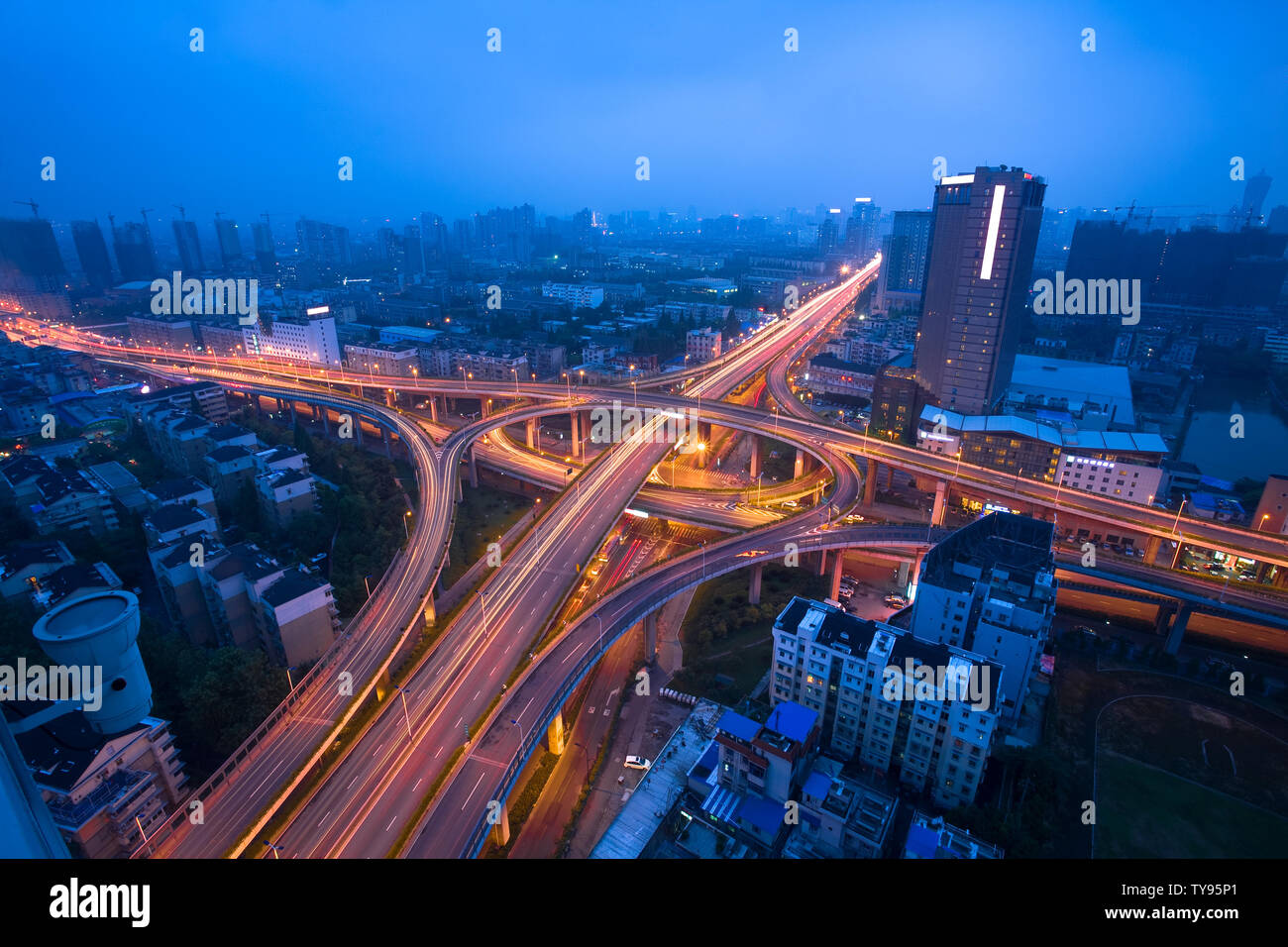 Freeway in night with cars light in modern city Stock Photo - Alamy