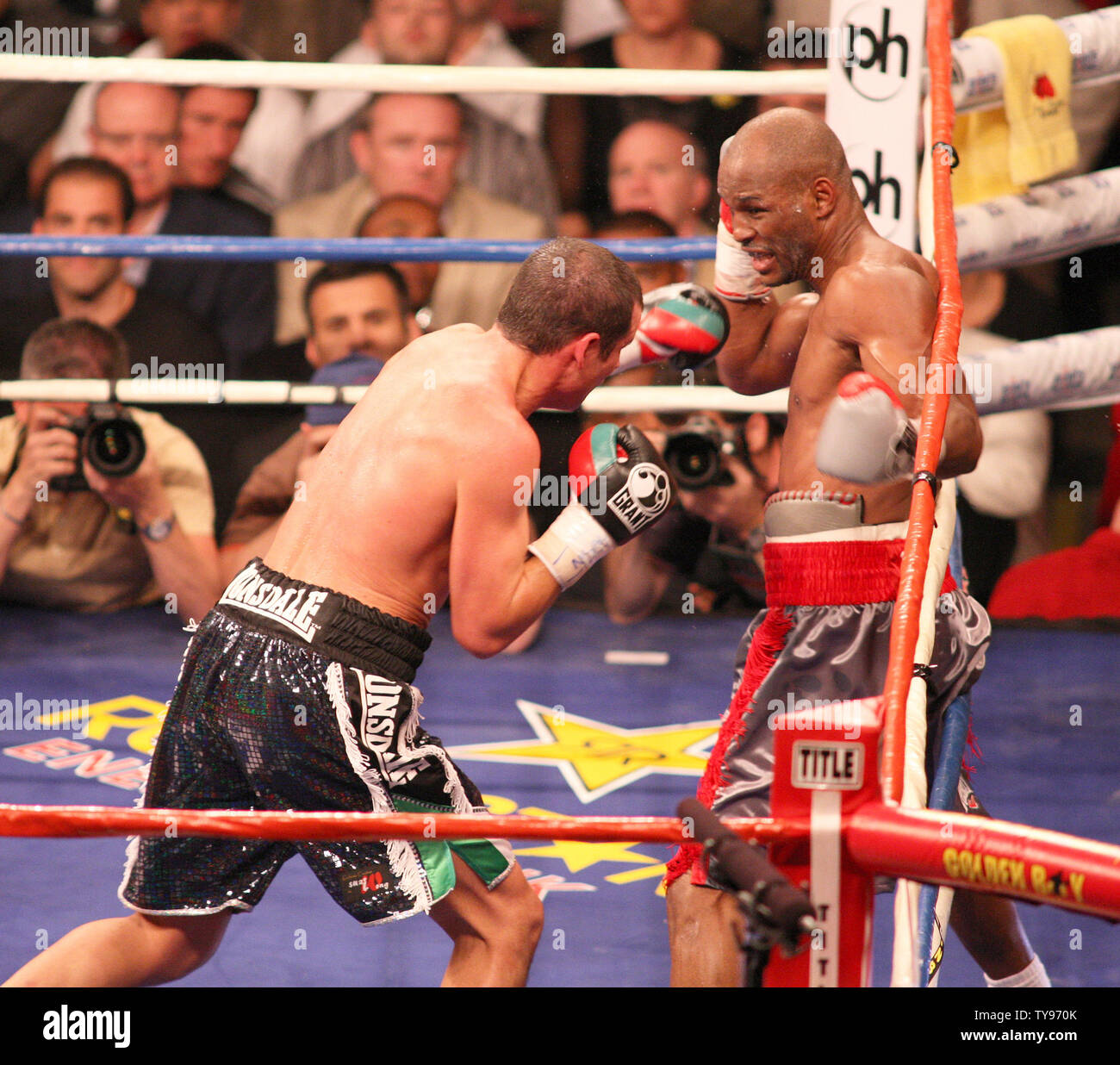 Joe Calzaghe of Wales (L) mixes it up with Bernard Hopkins at the ...