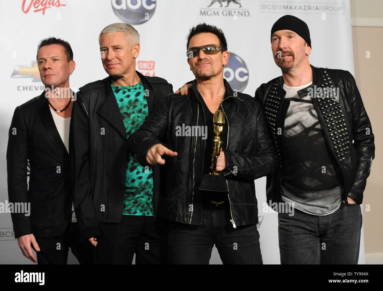 Members of the rock band U2 appear backstage after garnering Top ...