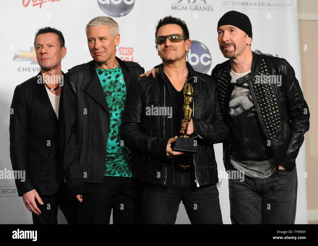 Members of the rock band U2 appear backstage after garnering Top ...