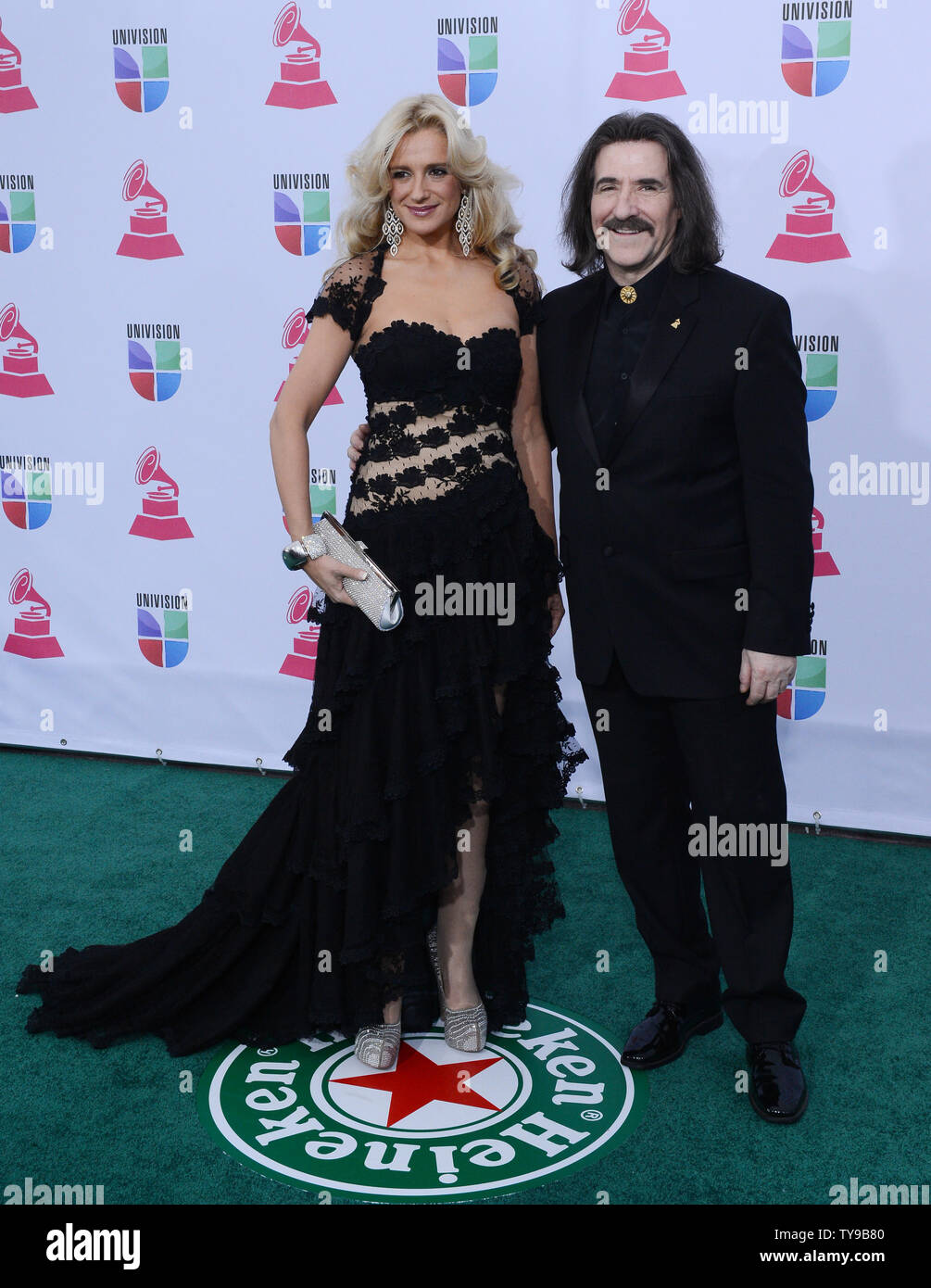 Chairman of the Latin Recording Academy Luis Cobos (R) and his wife ...