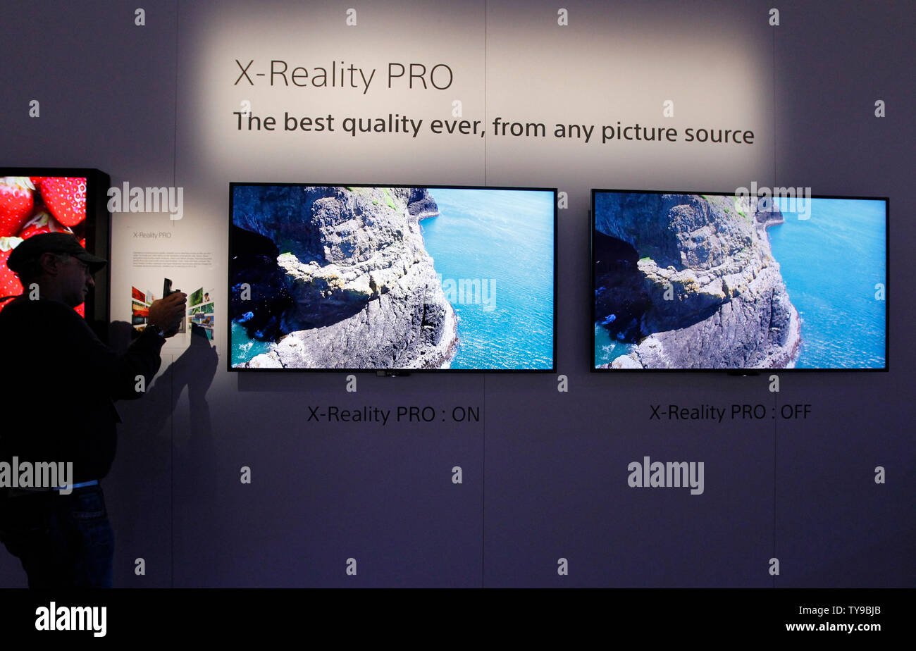 A man photographs a Sony with X Reality PRO image processing (Left ...