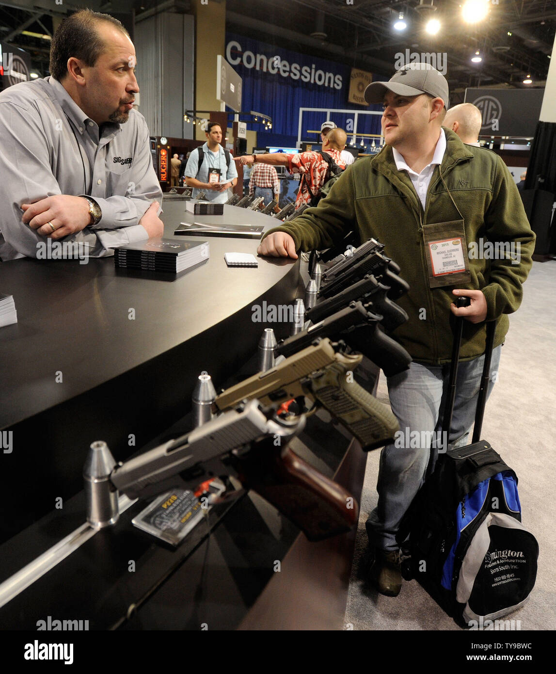 Hand guns are on display at the Sig Sauer booth at the National ...