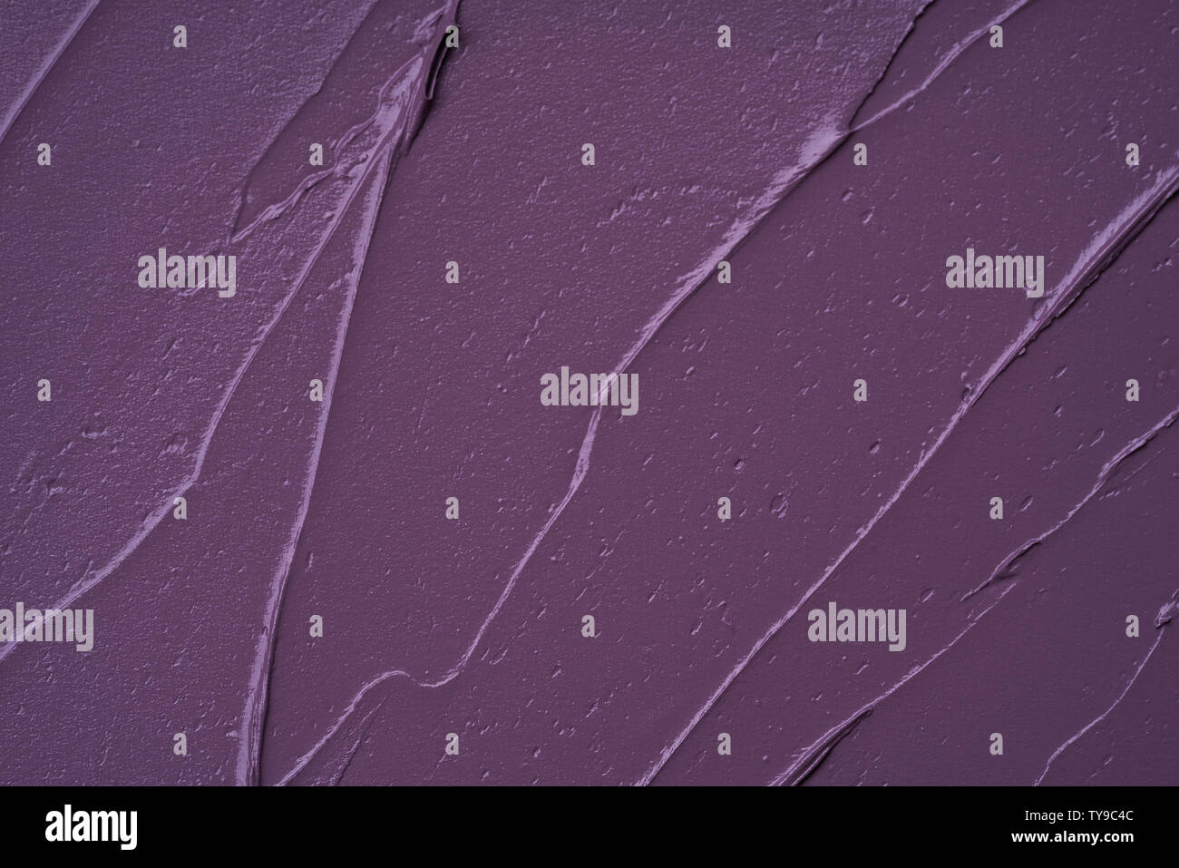 Pale purple smears and texture mascara or acrylic on a white background ...