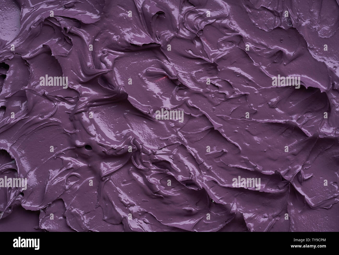 Pale purple smears and texture mascara or acrylic on a white background ...