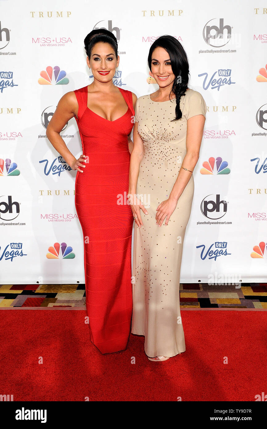 Professional wrestler and pageant judge Nikki Bella (L) and Brie Bella ...