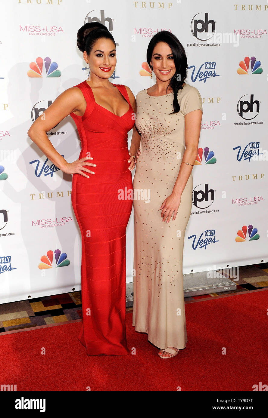 Professional wrestler and pageant judge Nikki Bella (L) and Brie Bella ...
