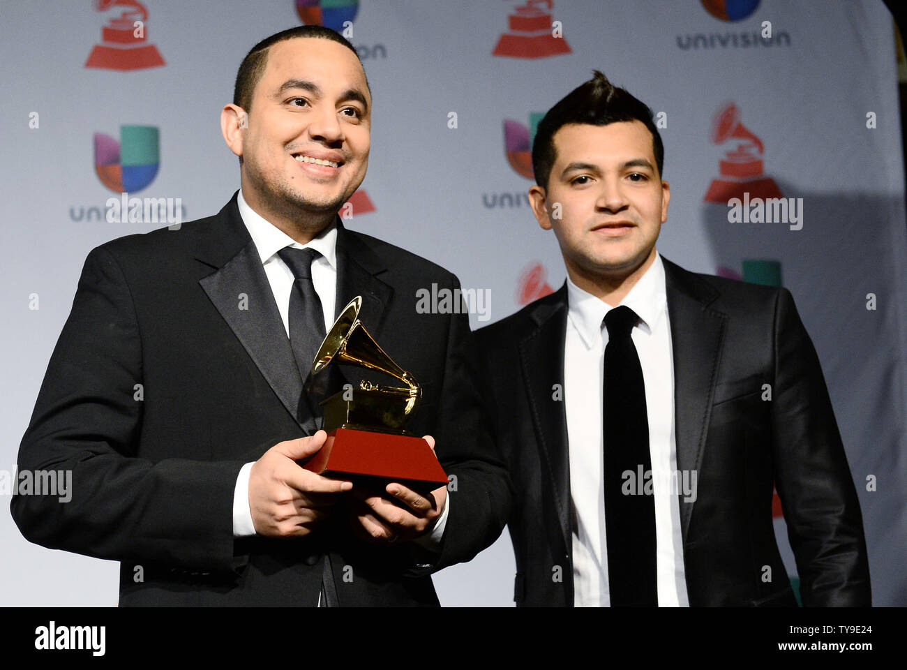Musicians Felipe Pelaez (L) and Manuel Julian hold the award they won ...