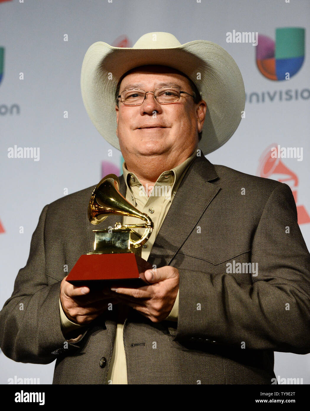 Musician David Lee Garza holds the award he won for Best Tejano Album ...