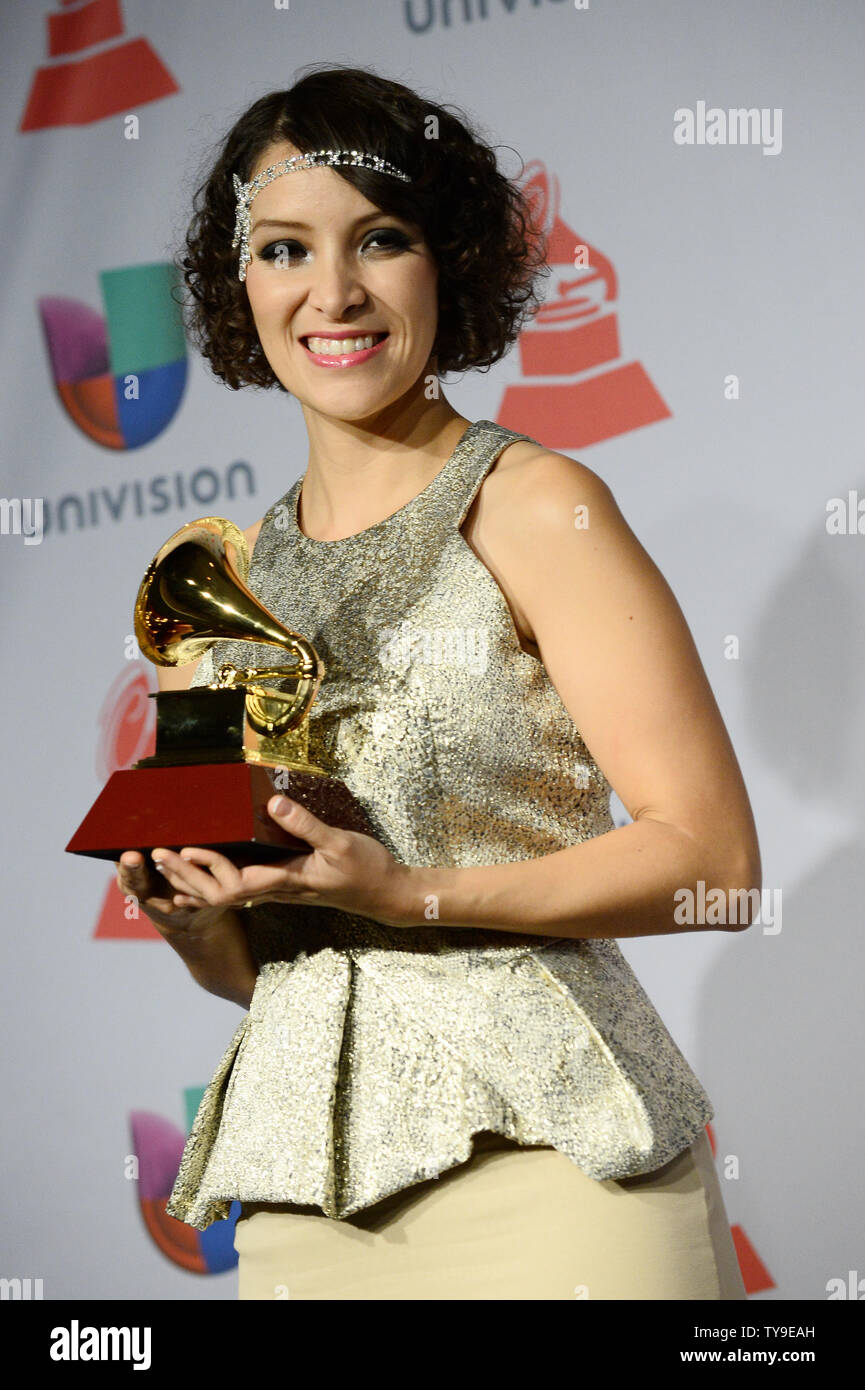Recording artist Gaby Moreno holds the award she won for Best New ...