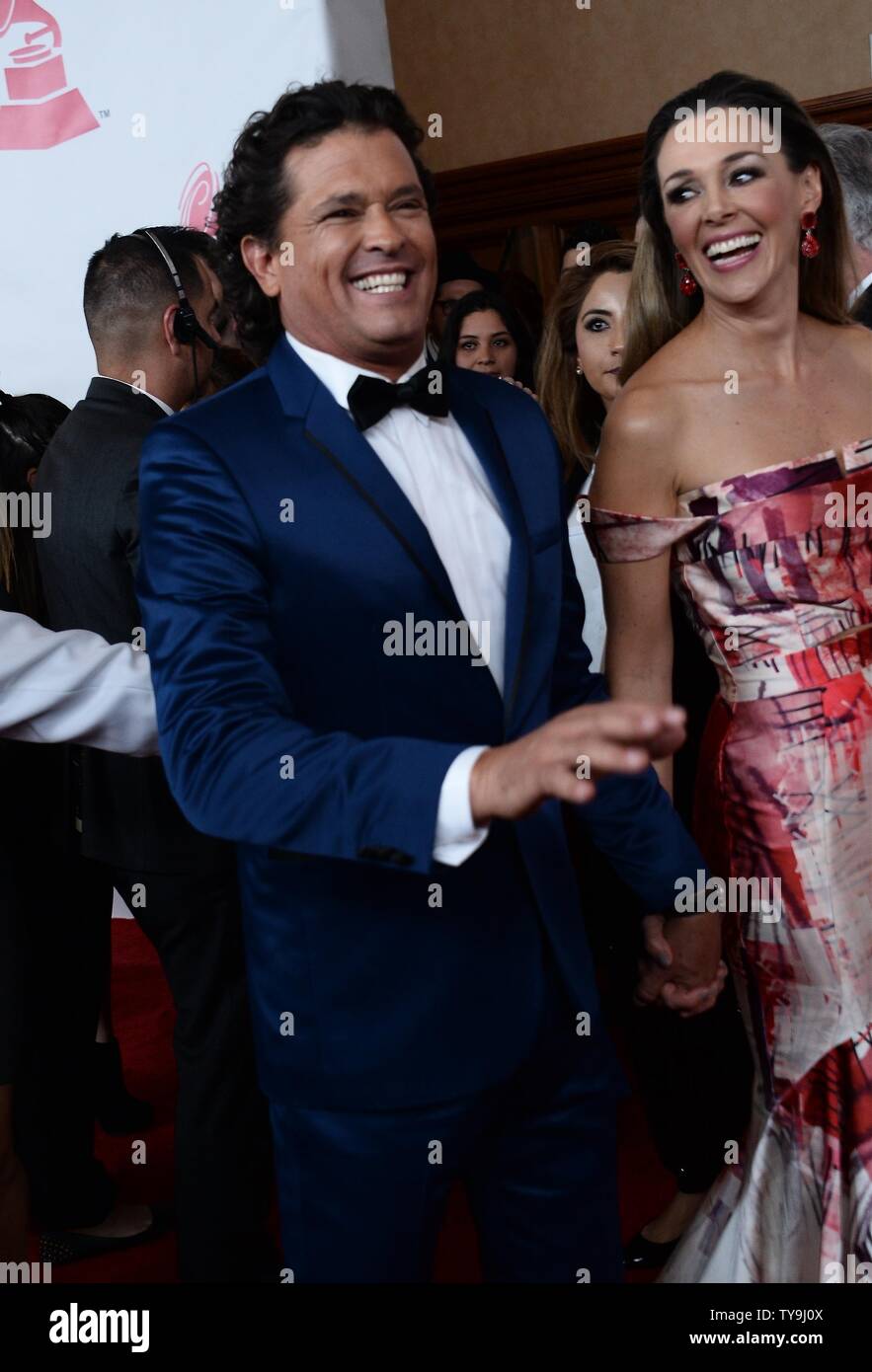 Carlos Vives (L) and Claudia Elena arrive for the Latin Recording ...