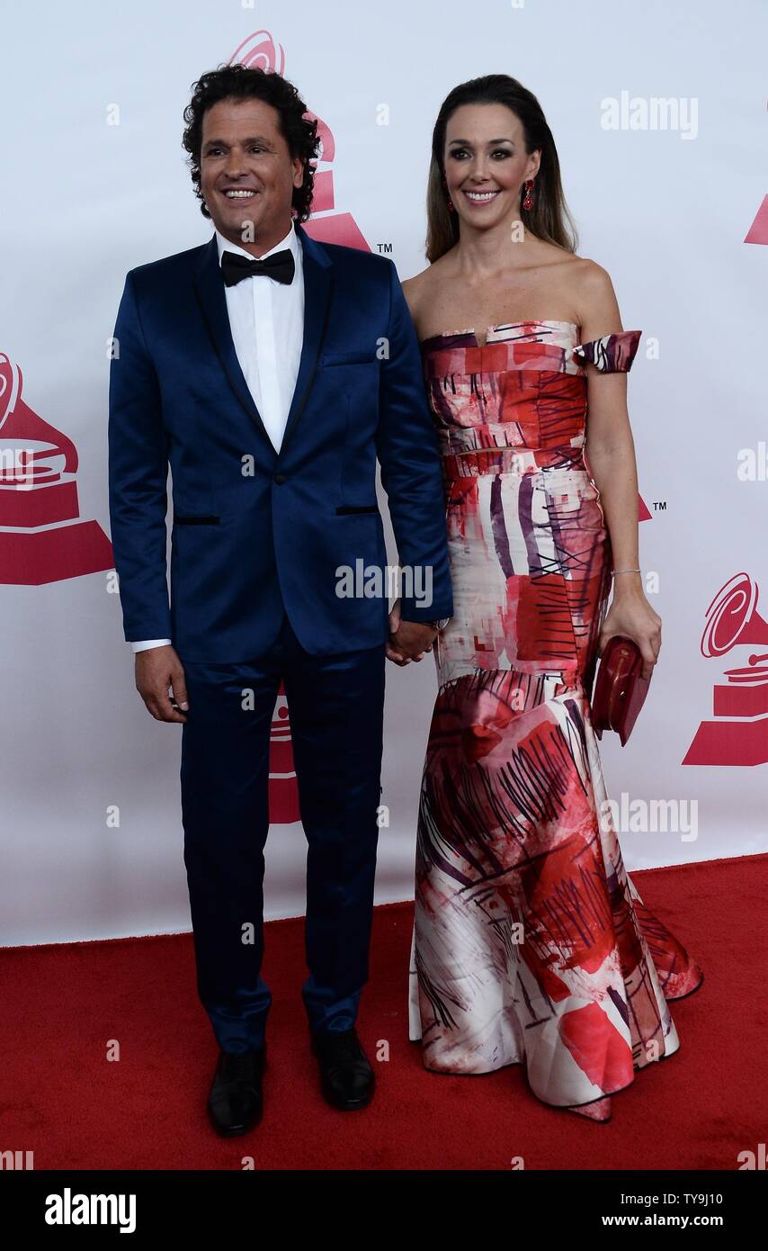 Carlos Vives (L) and Claudia Elena arrive for the Latin Recording ...