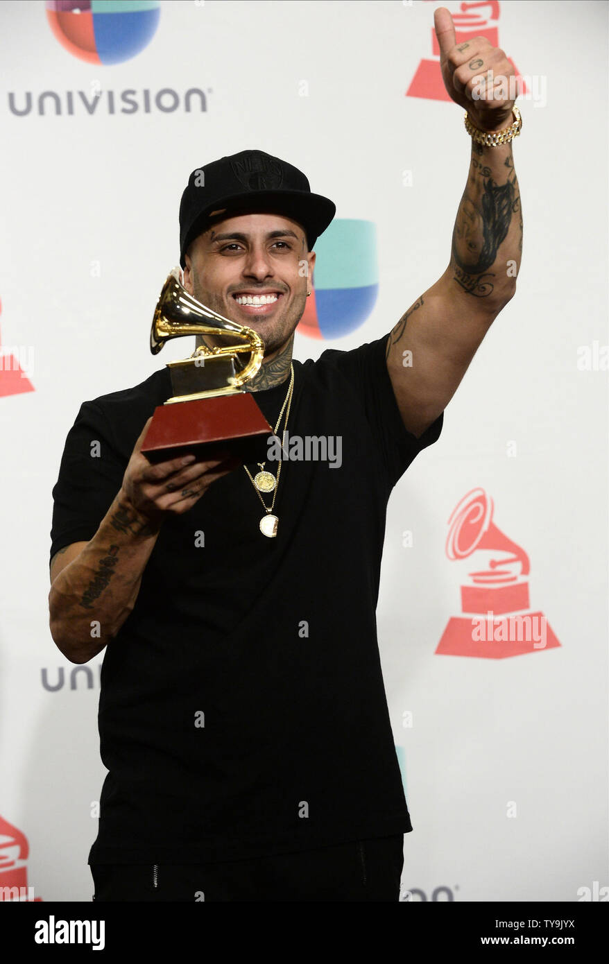 Nicky Jam poses in the pressroom with the award for Best Urban ...