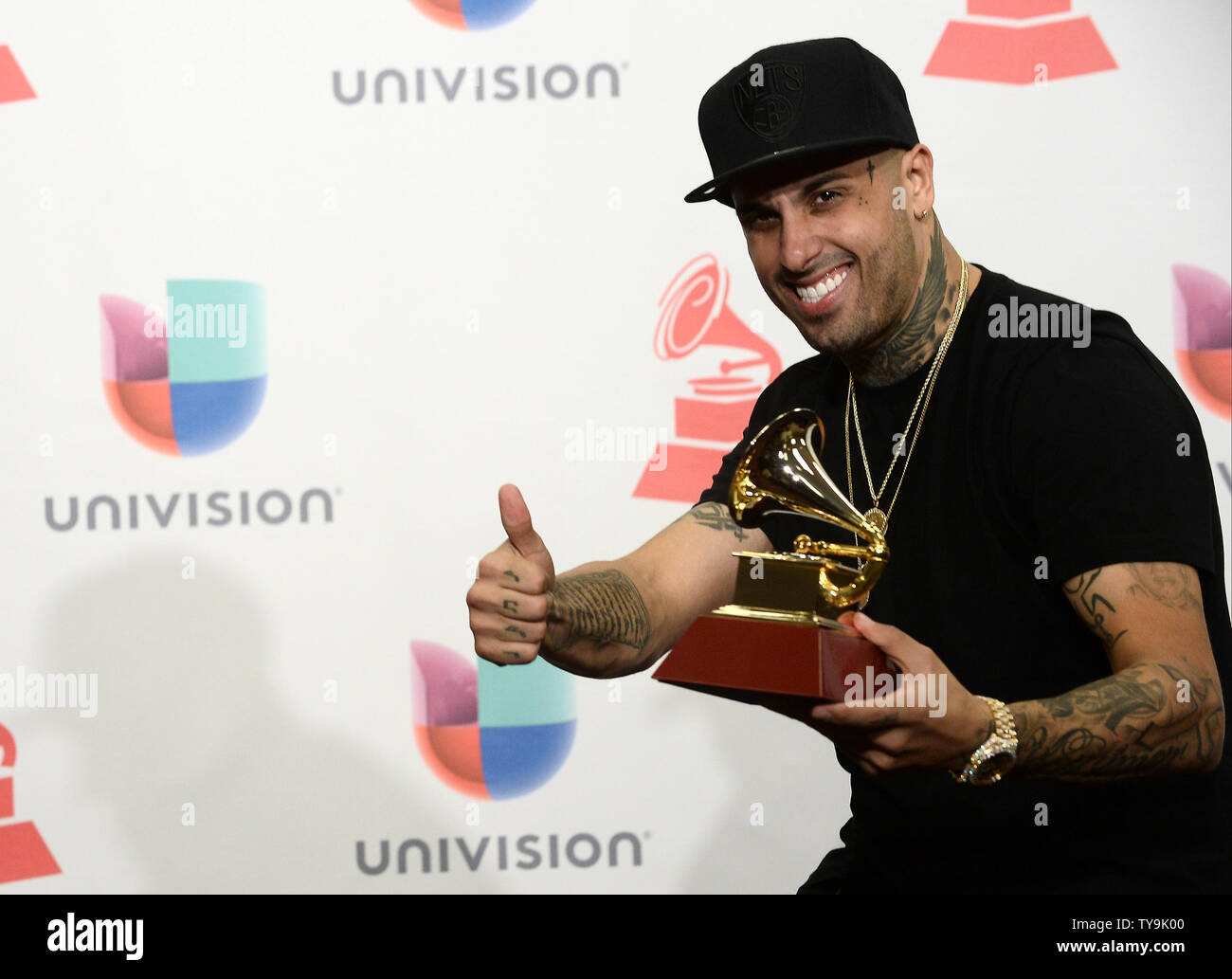 Nicky Jam poses in the pressroom with the award for Best Urban ...