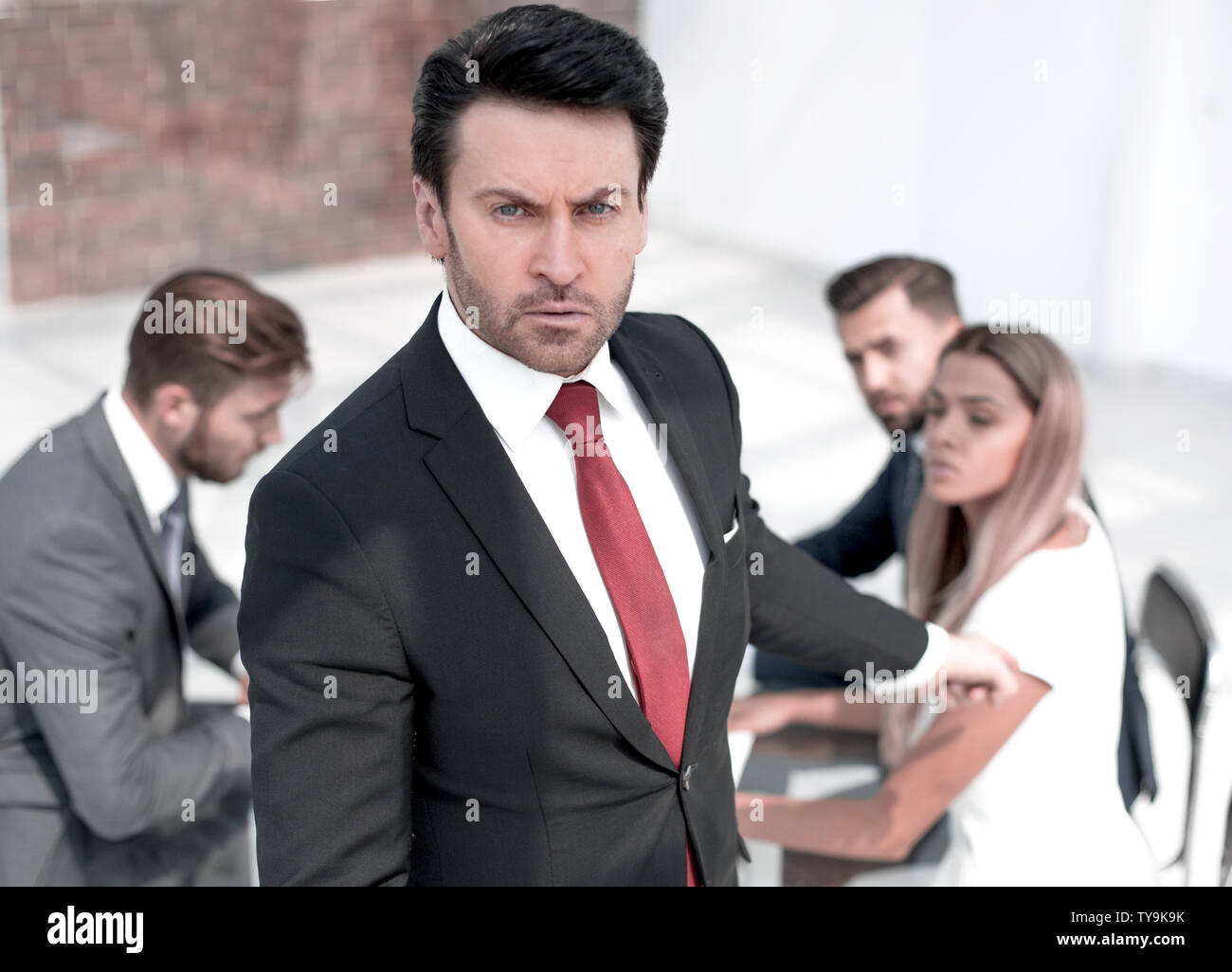 strict boss standing in the office Stock Photo - Alamy