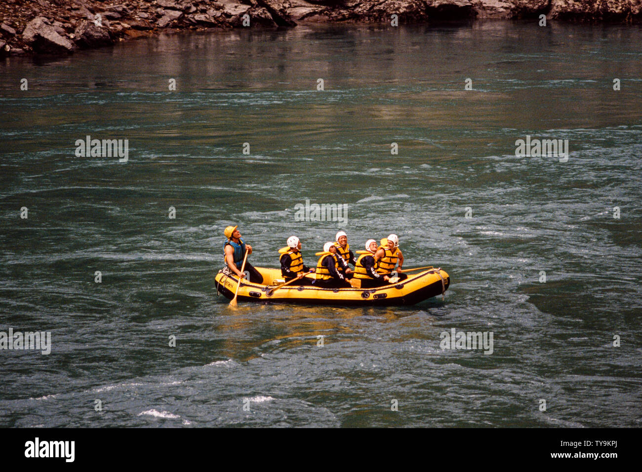 New Zealand, South Island. White water rafters drifting on a quiet ...