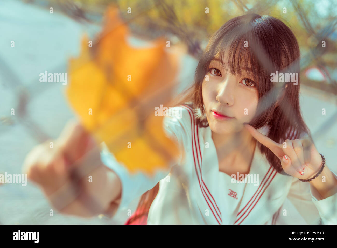 Girl behind the maple leaf hi-res stock photography and images - Alamy