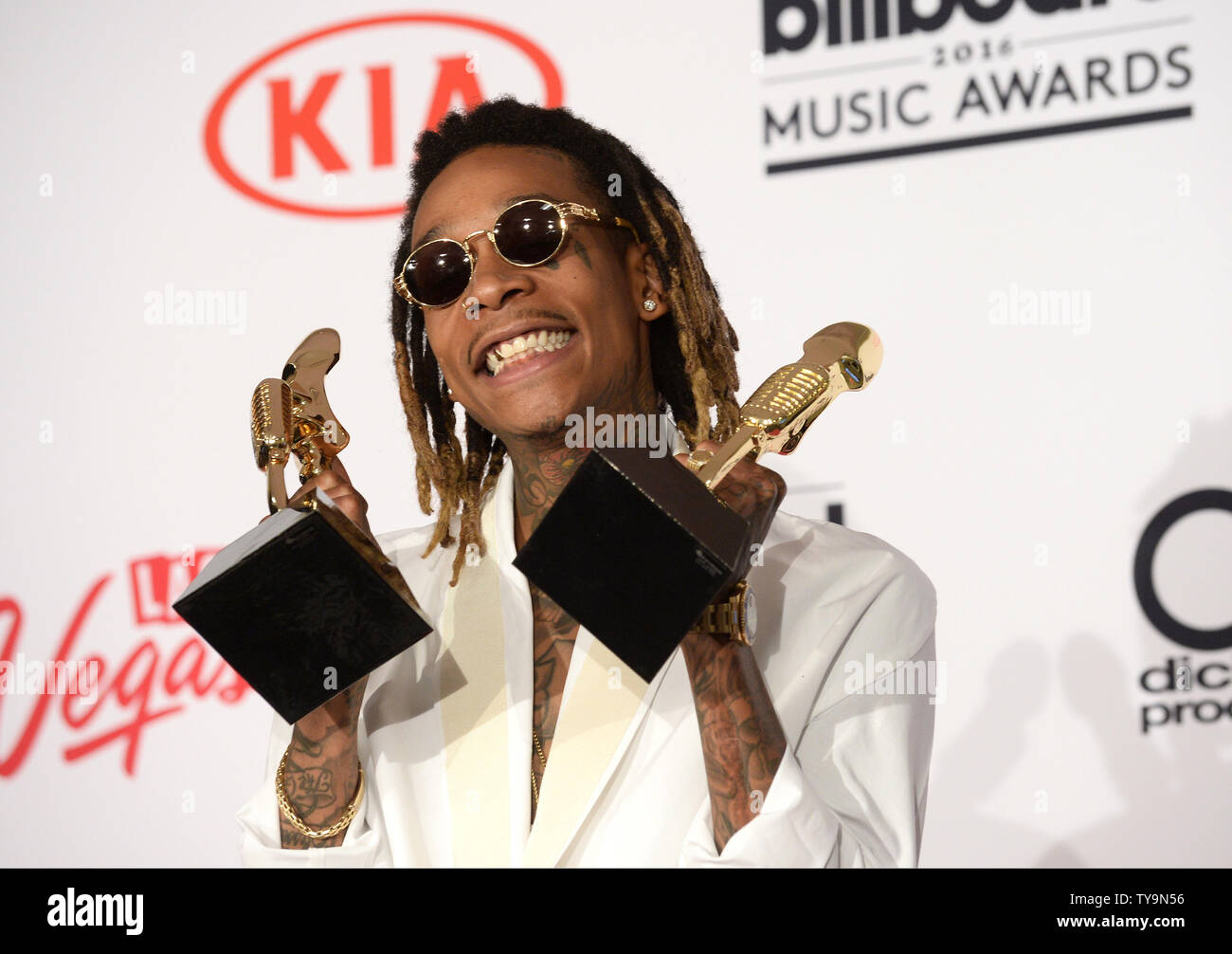 Singer Wiz Khalifa appears backstage with the Top Hot 100 Song Award ...