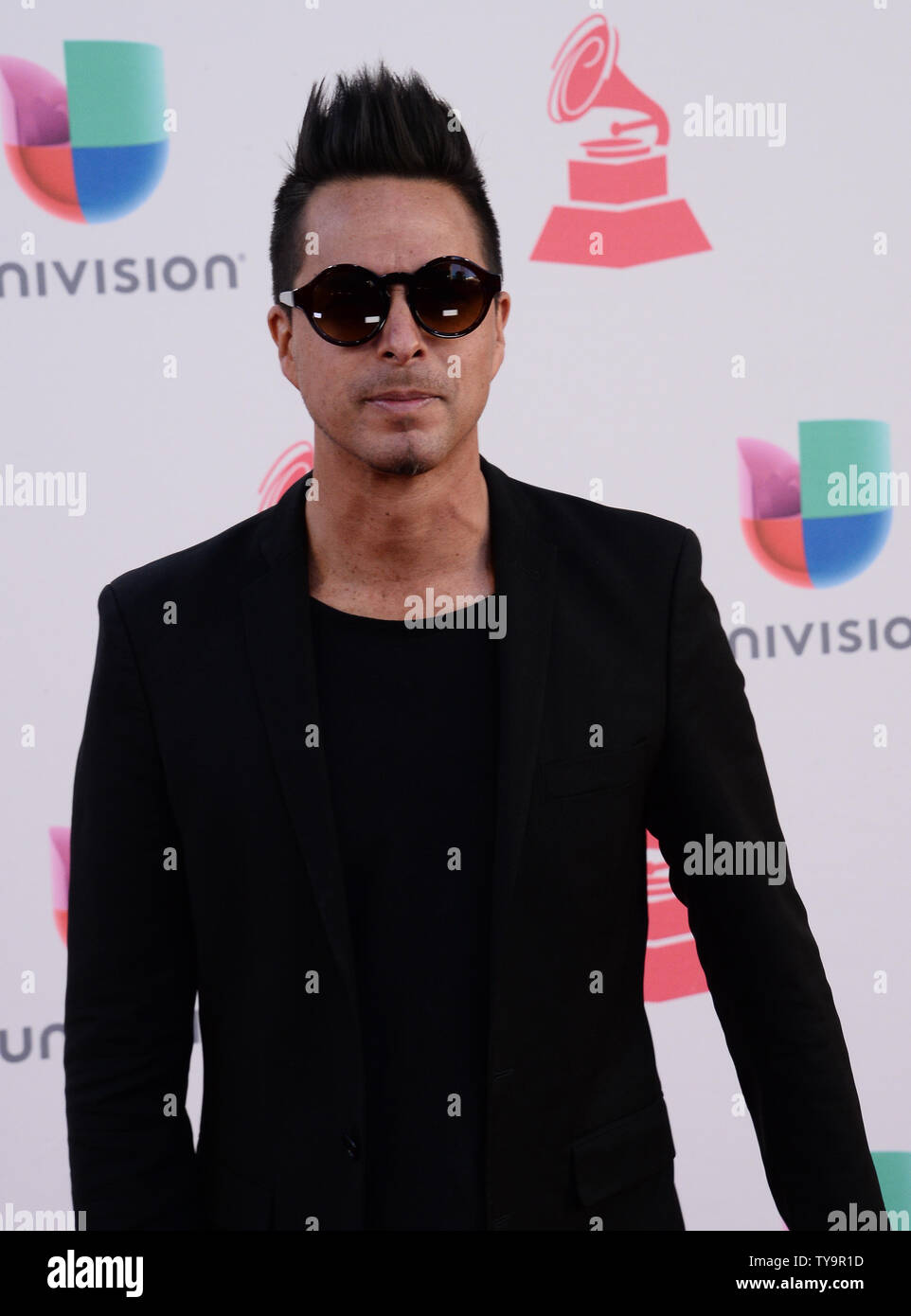 DJ Alex Midi arrives on the red carpet for the 17th annual Latin Grammy ...